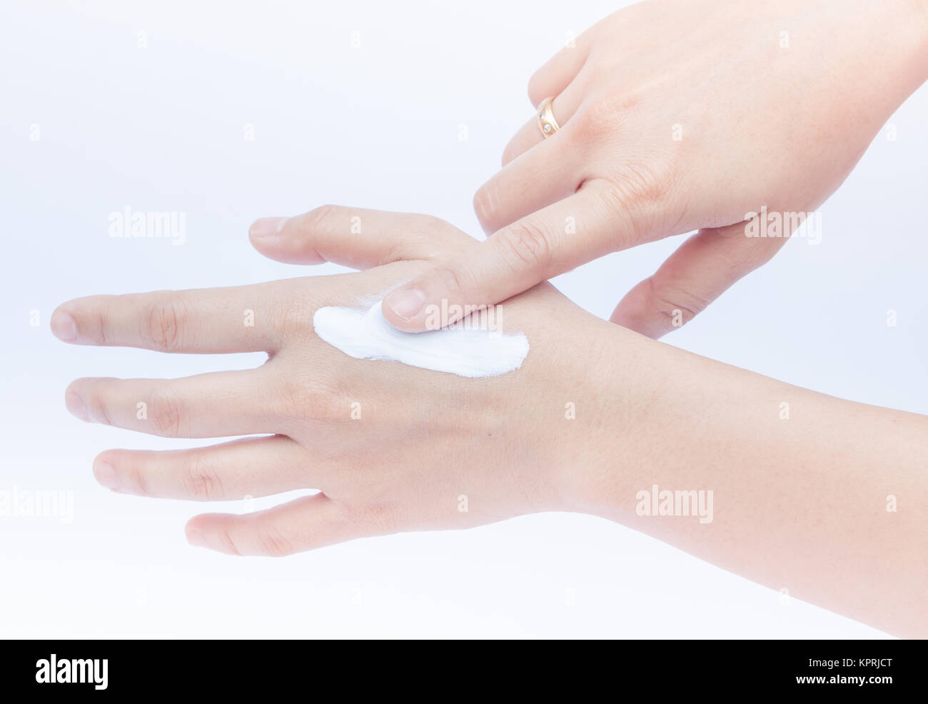 Woman pouring body lotion on hand Stock Photo - Alamy