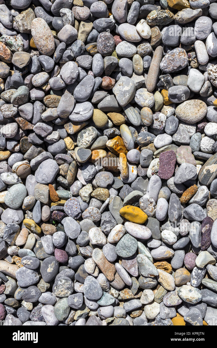 Small pebbles background Stock Photo - Alamy