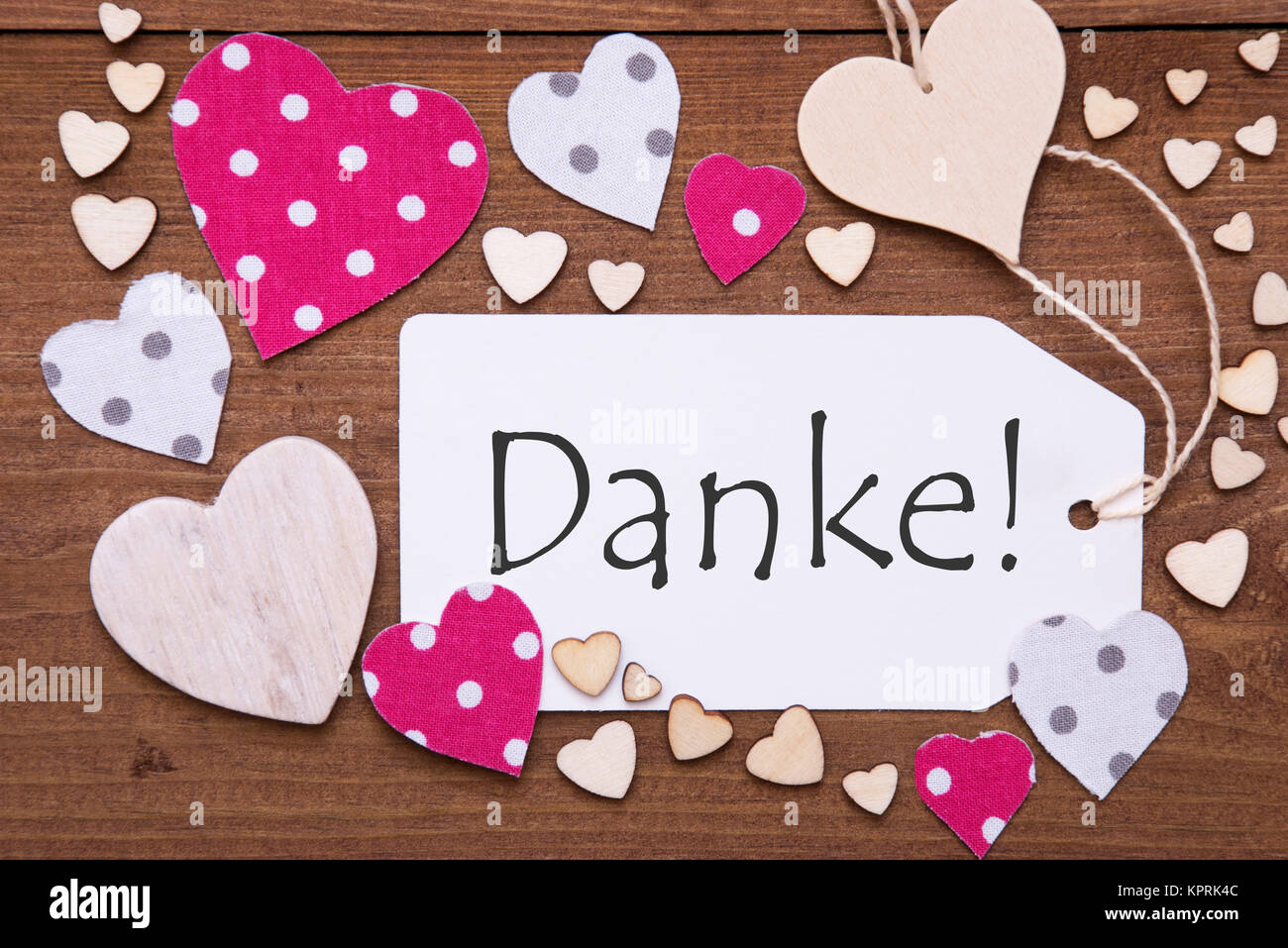 Label With Pink Textile Hearts On Wooden Background. German Text Danke ...