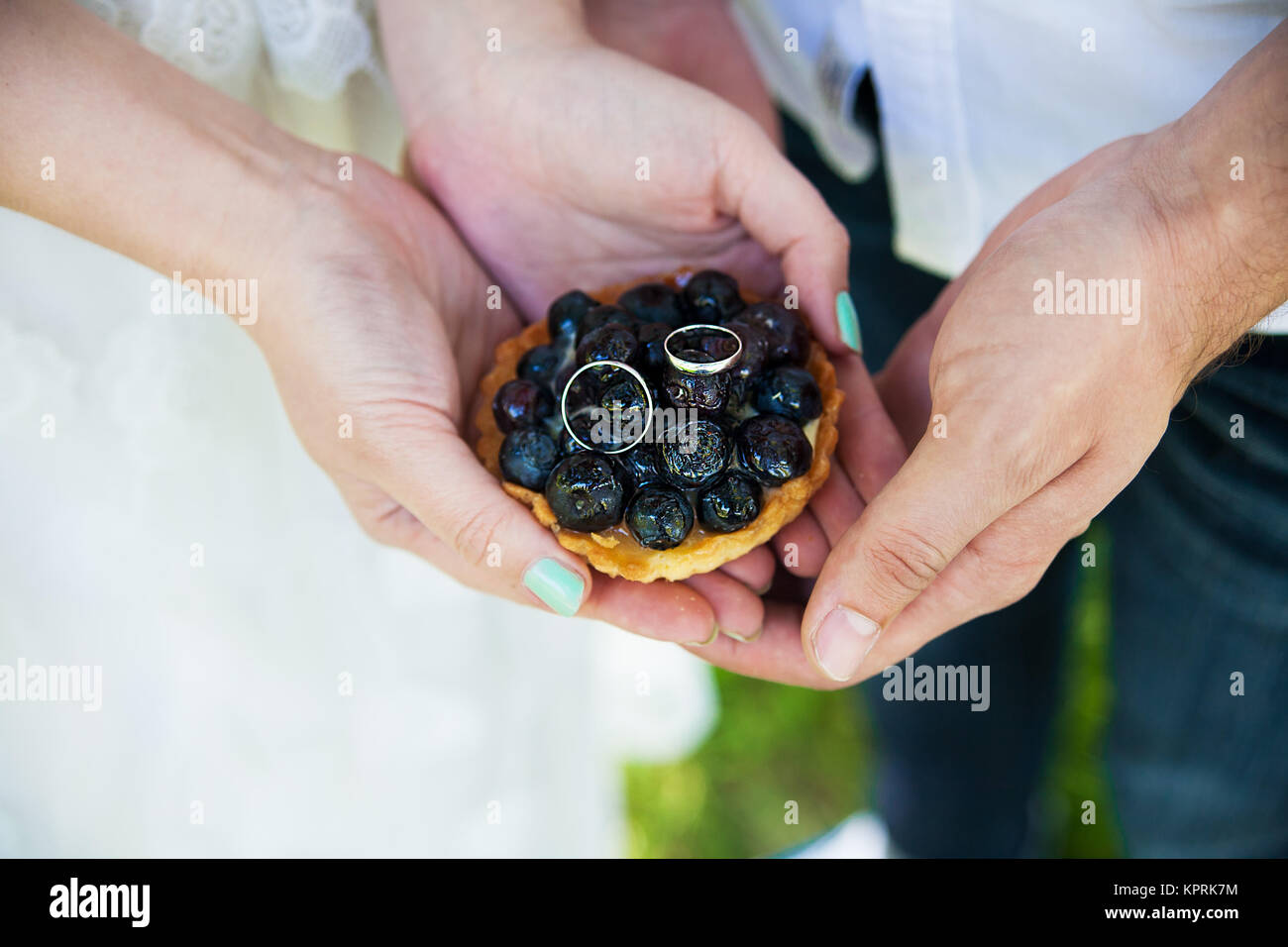 hands of a young wedding couple Stock Photo - Alamy