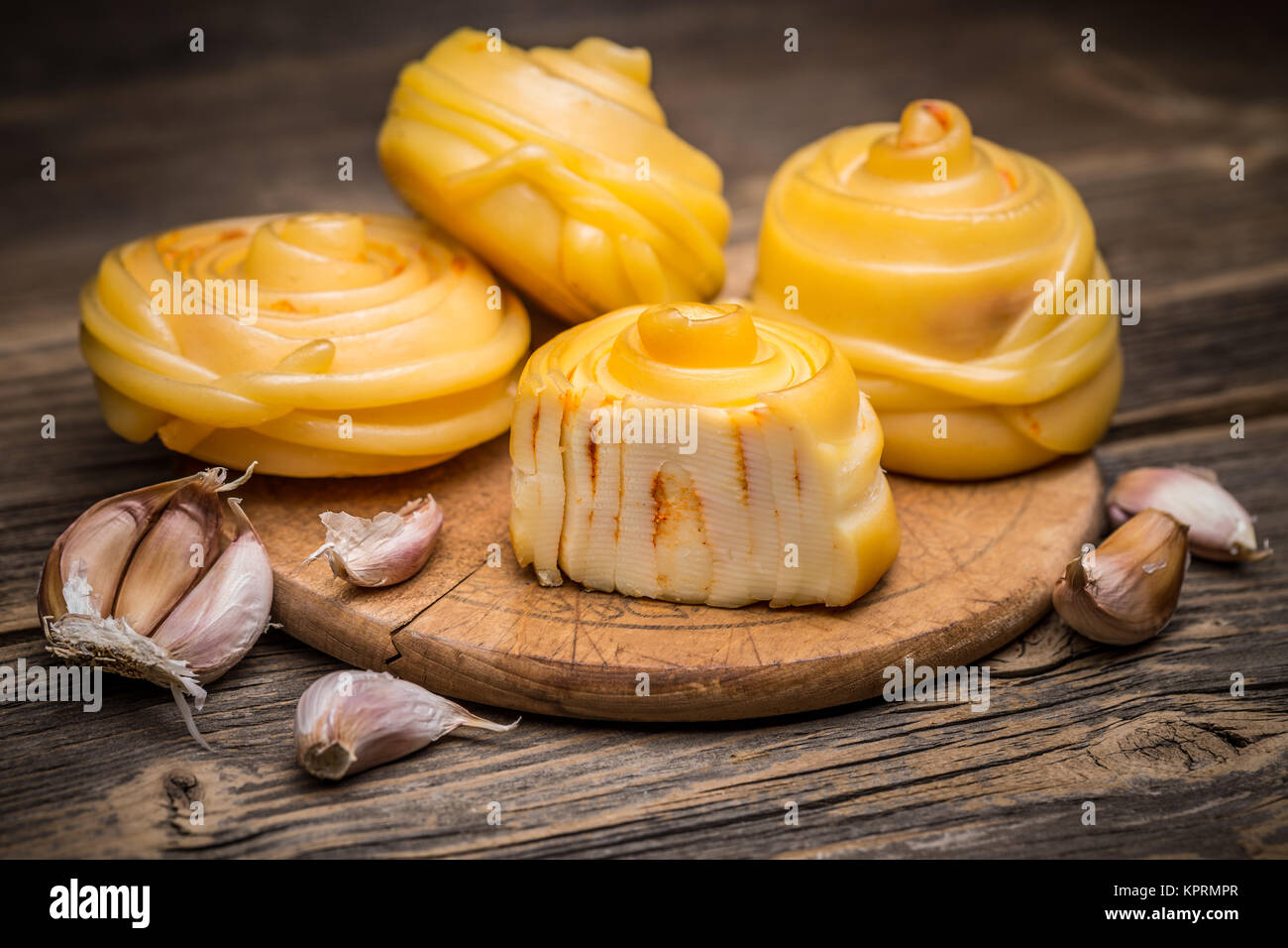 Handicraft twisted cheese Stock Photo - Alamy