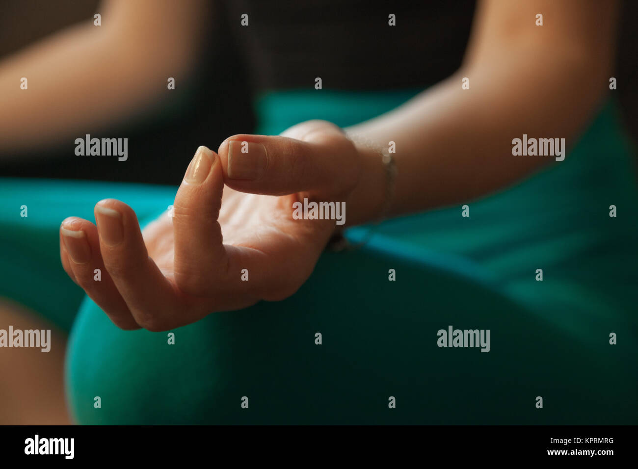 Woman's hands in meditation pose Stock Photo - Alamy