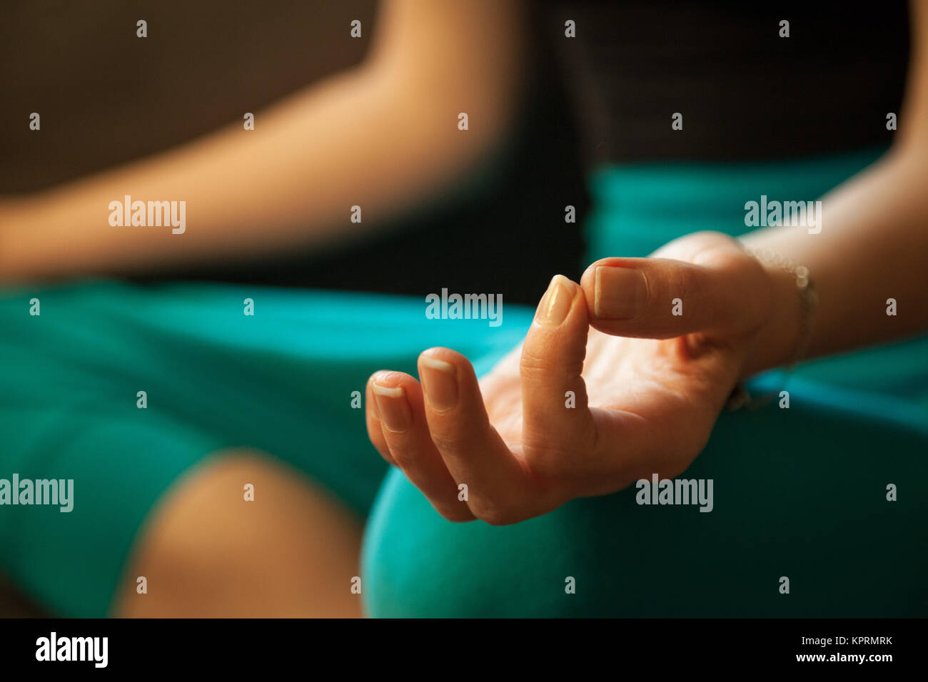 Woman's hands in meditation pose Stock Photo - Alamy