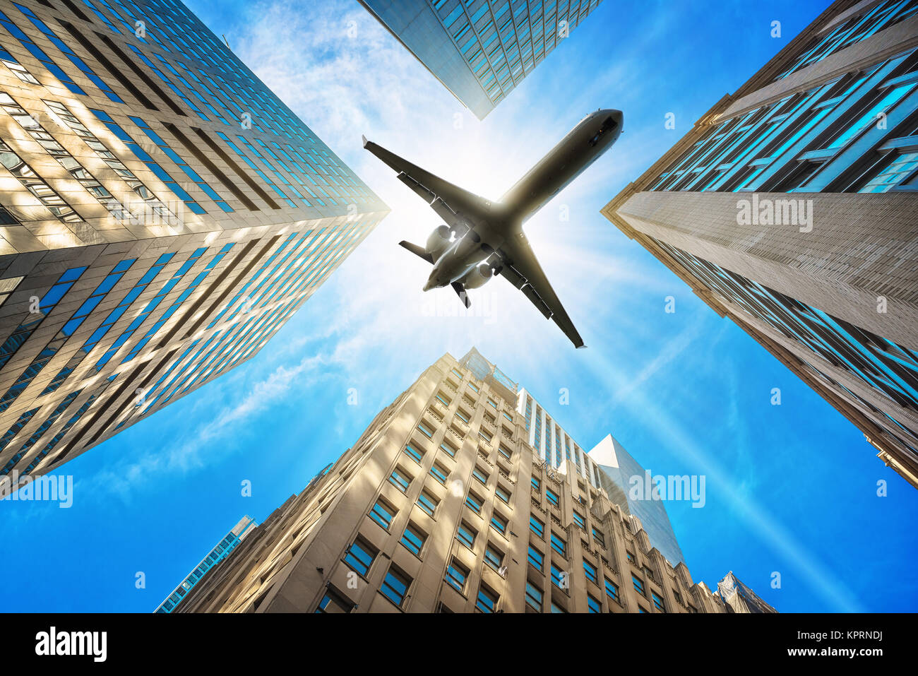 airplane over skyscrapers Stock Photo - Alamy