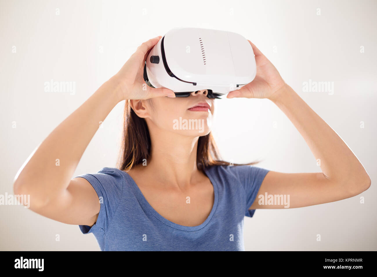 Woman use of VR device Stock Photo - Alamy