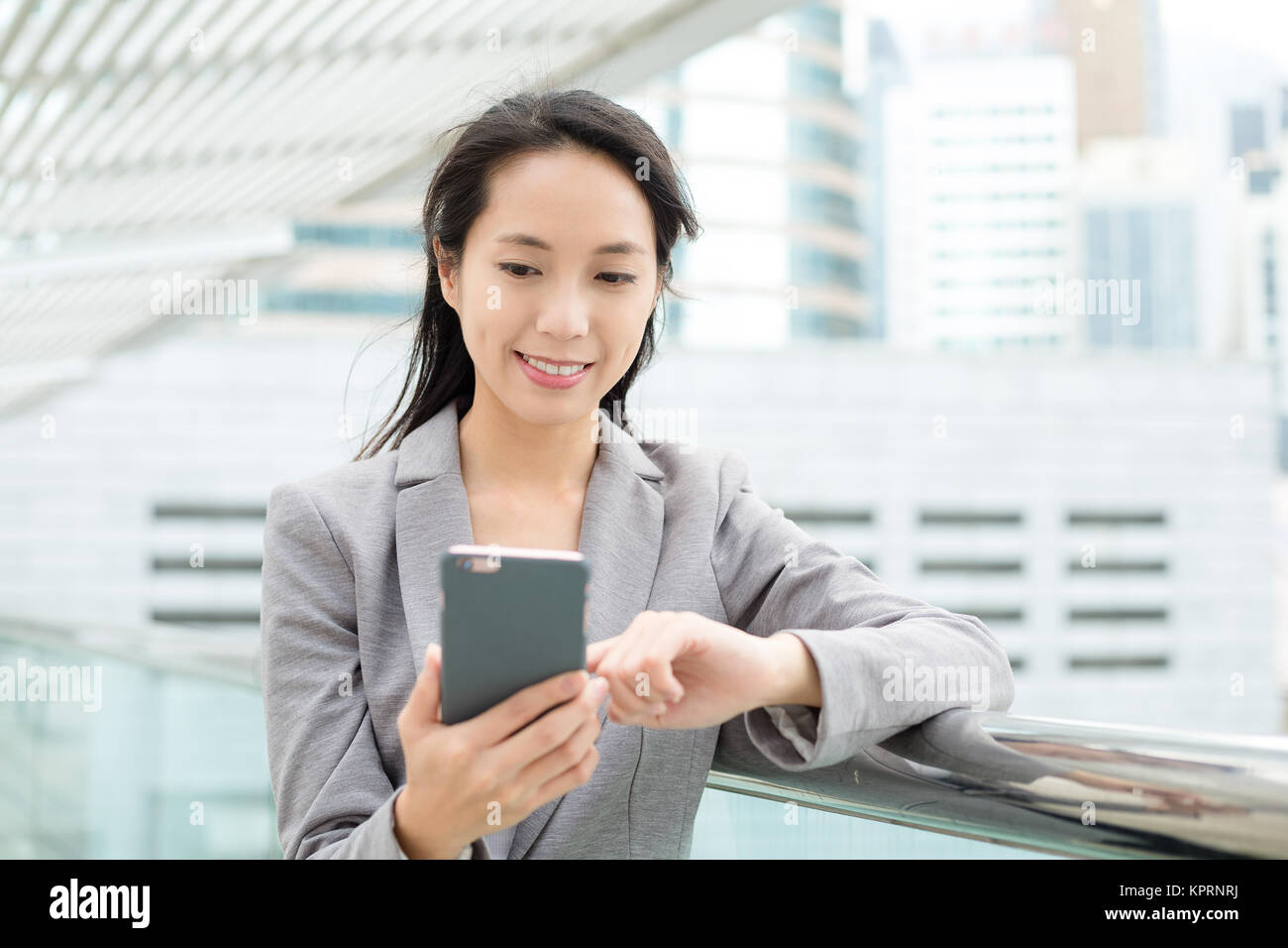 Woman using a cell phone Stock Photo - Alamy