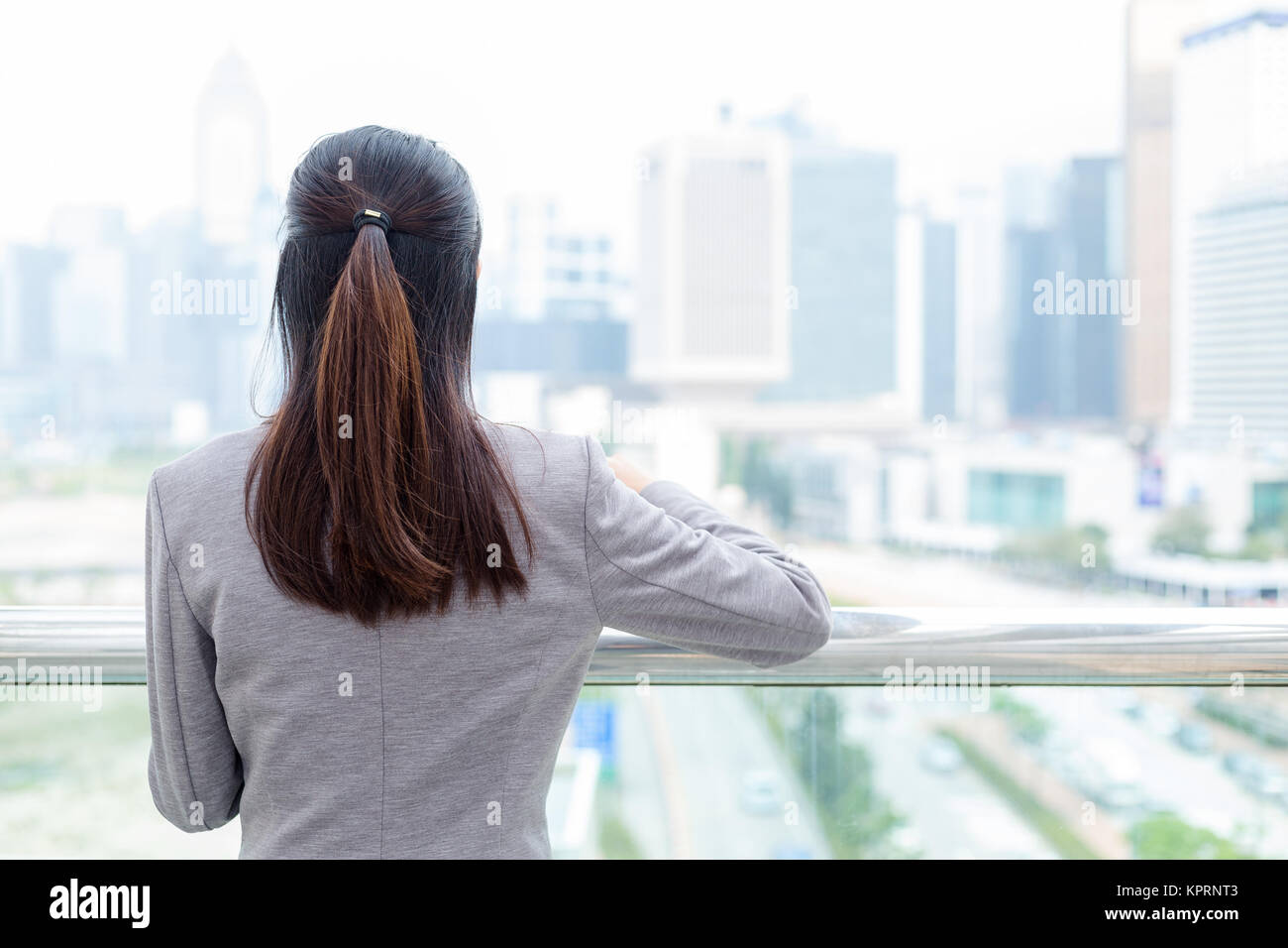 Back view of businesswoman Stock Photo - Alamy