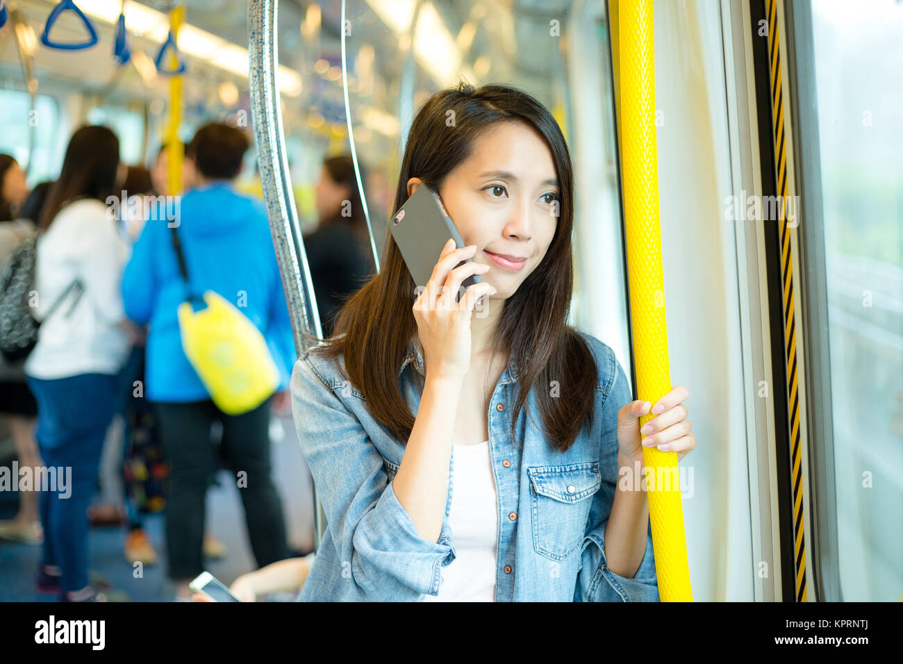 Woman pick up a call inside train compartment Stock Photo - Alamy