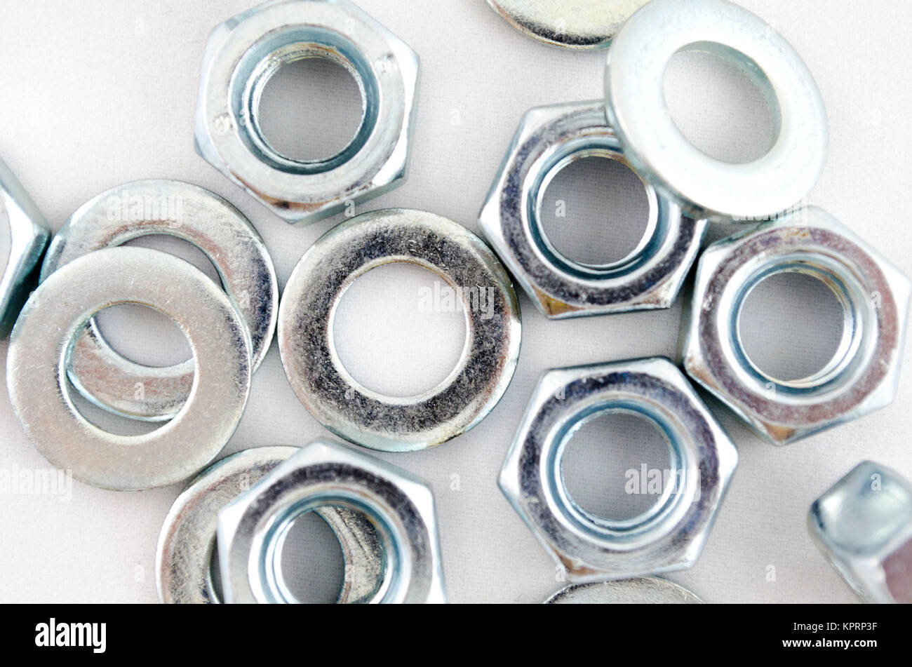 Several metal screw washers and nuts Stock Photo - Alamy
