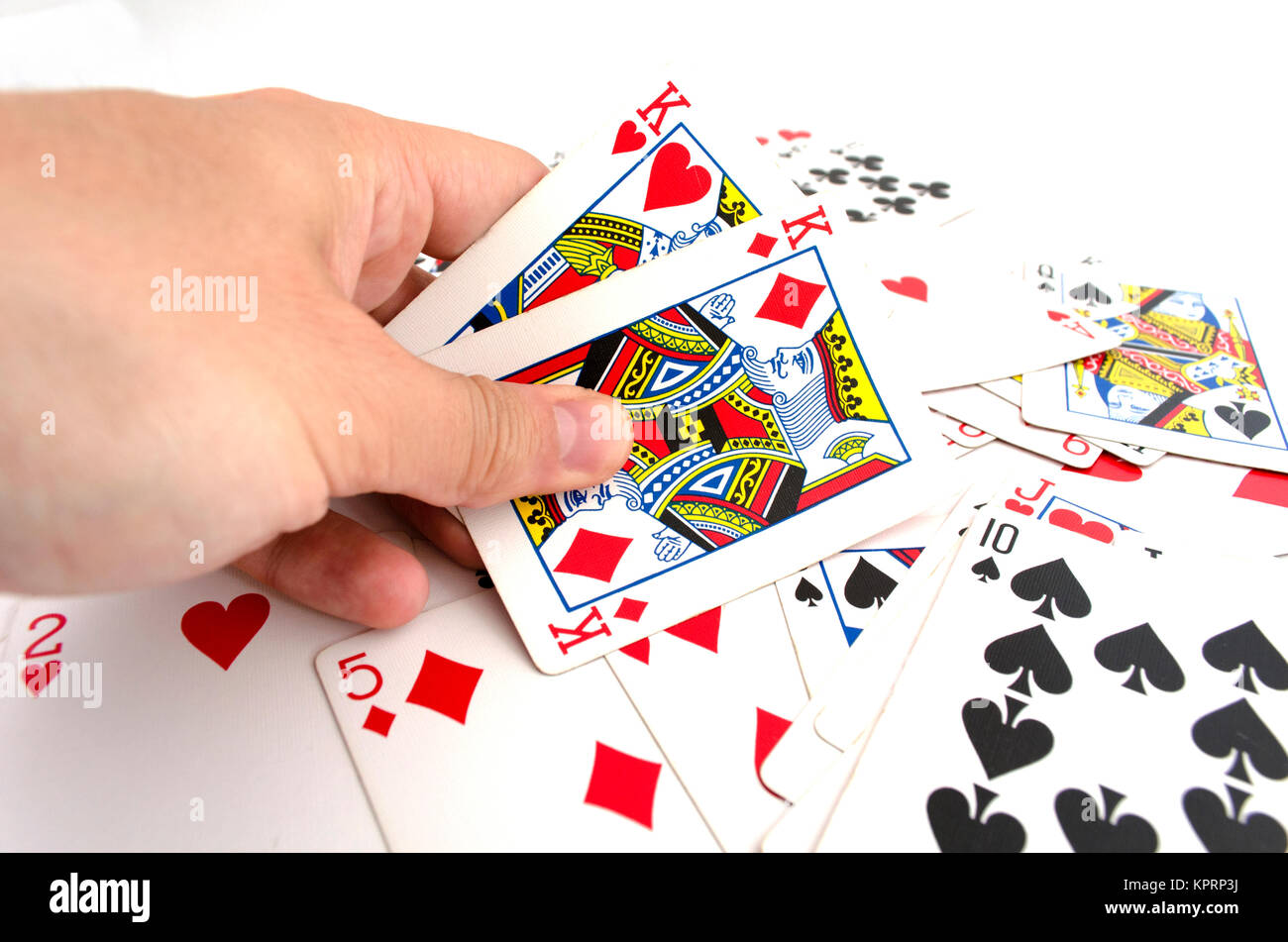 Playing cards in hand Stock Photo - Alamy