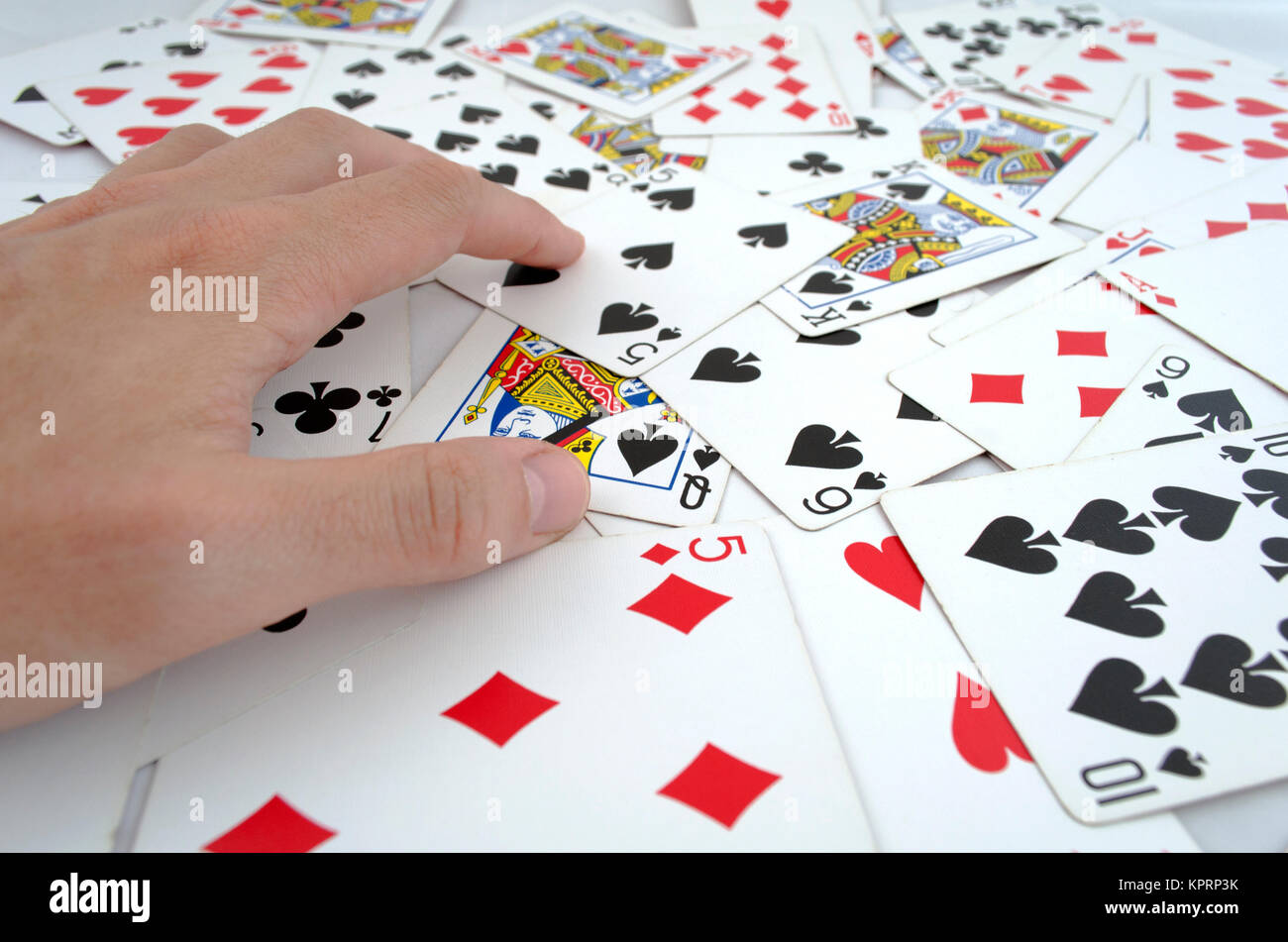 Playing cards in hand Stock Photo - Alamy