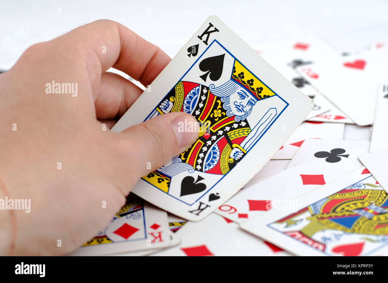 Playing cards in hand Stock Photo - Alamy