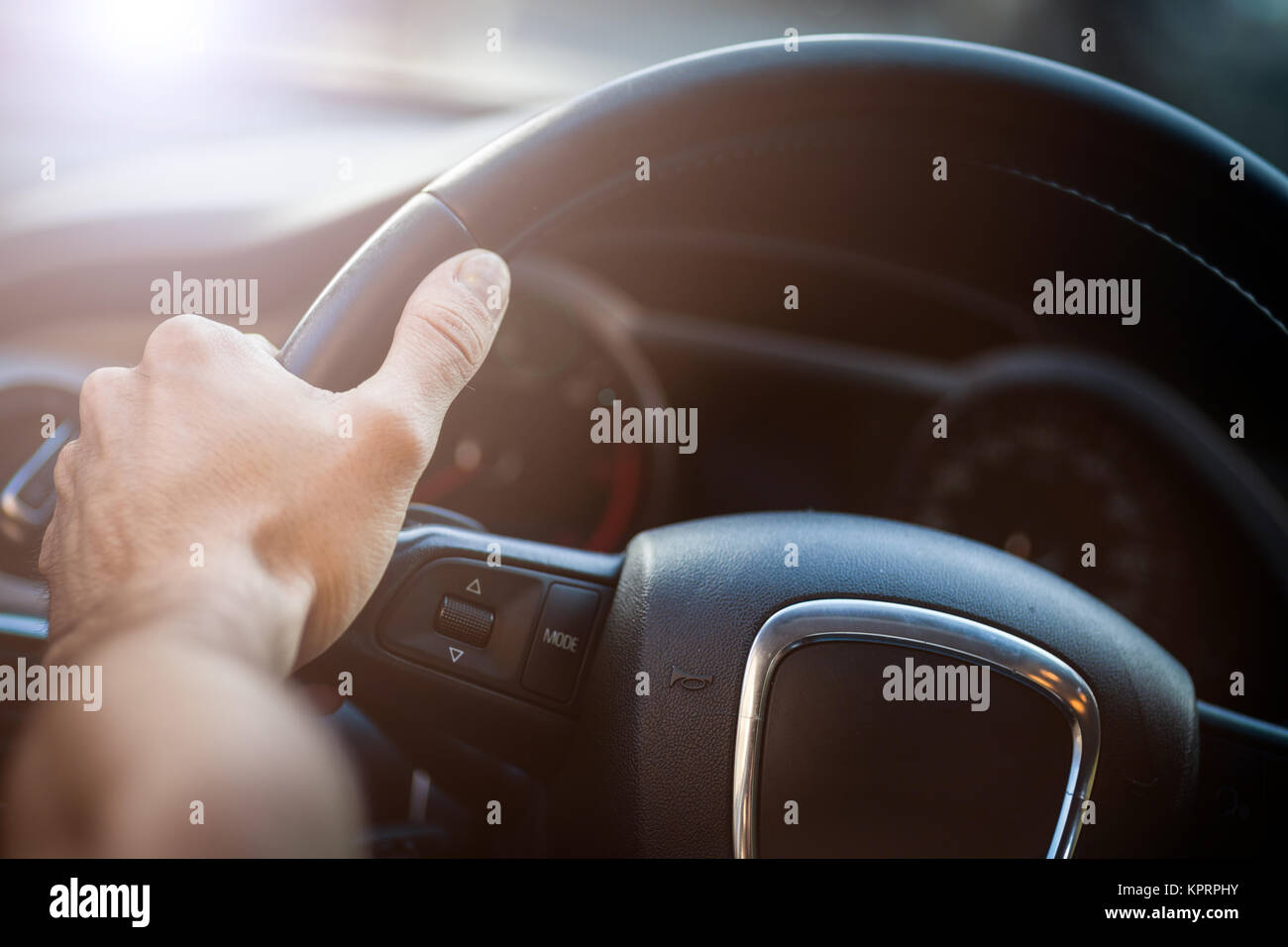 Hands on steering wheel Stock Photo - Alamy