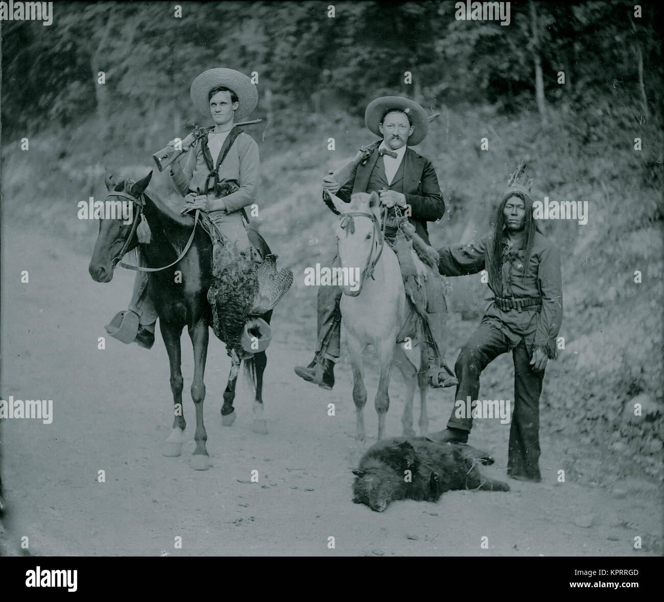 Two White Men And An Indian Out For Game Stock Photo - Alamy