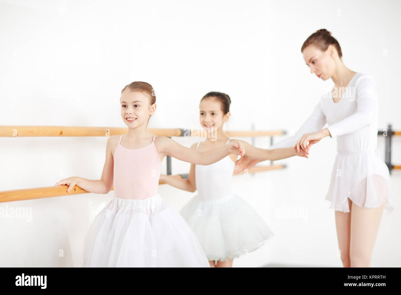 Repeating with teacher Stock Photo - Alamy