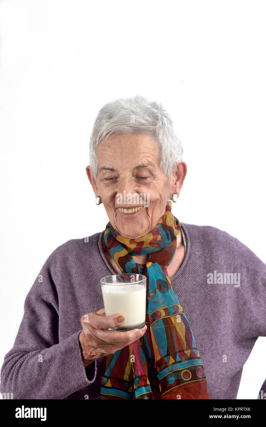 senior woman drinking milk on white background Stock Photo - Alamy