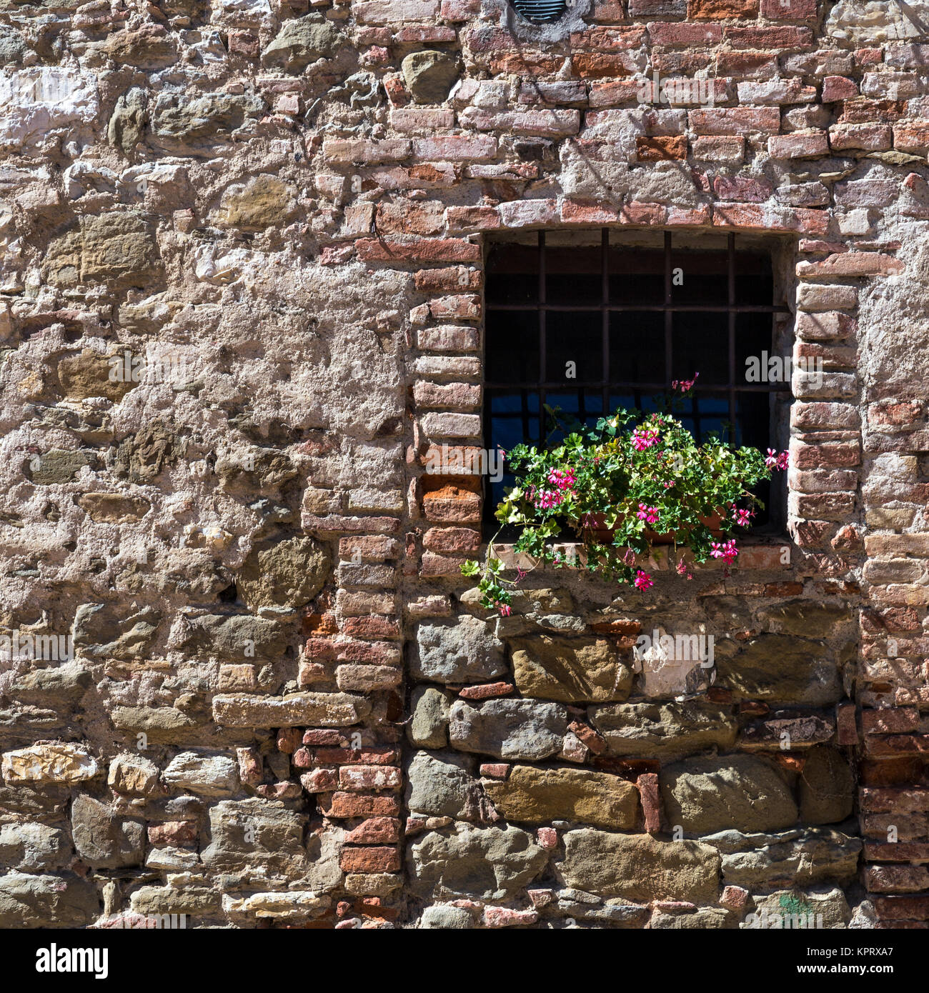 Assisi (Italy): Window on medieval stone wall Stock Photo - Alamy