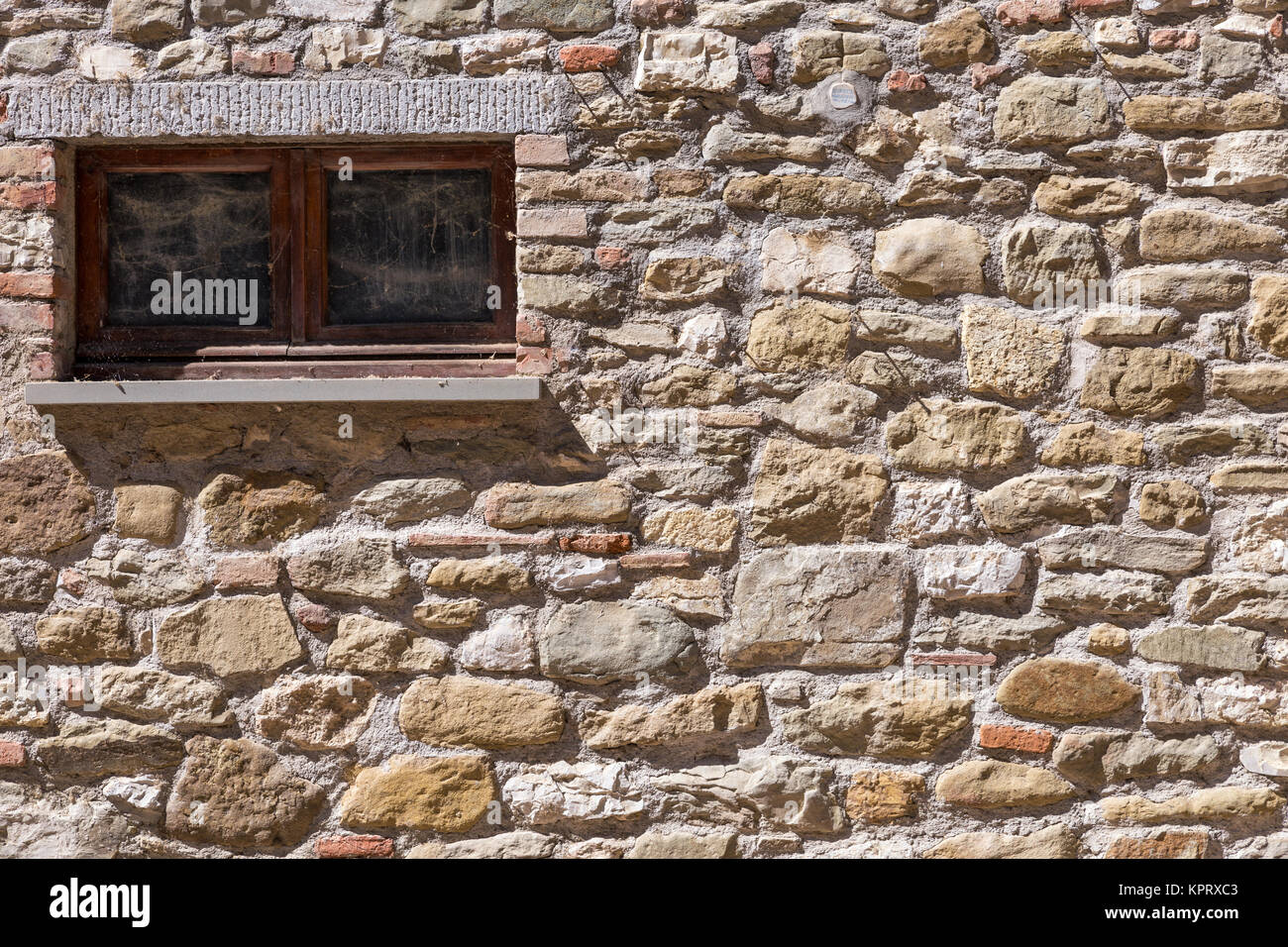 Assisi (Italy): Window on medieval stone wall Stock Photo - Alamy