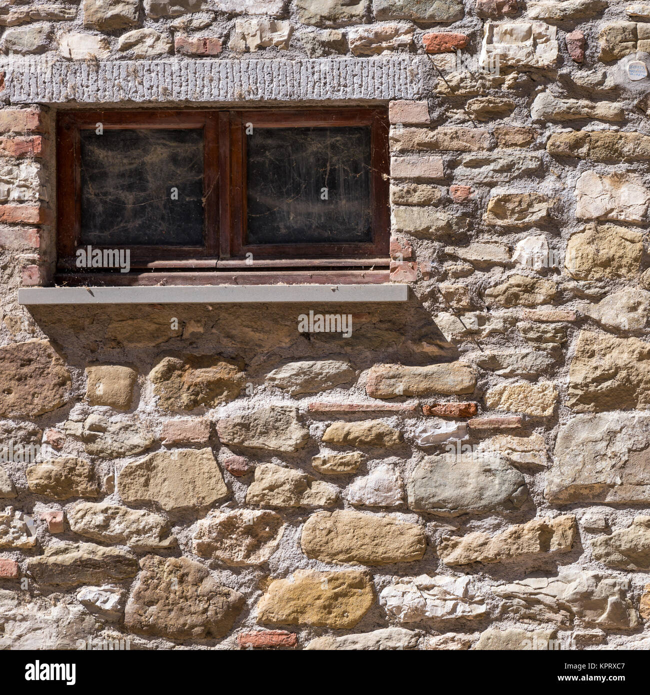 Assisi (Italy): Window on medieval stone wall Stock Photo - Alamy