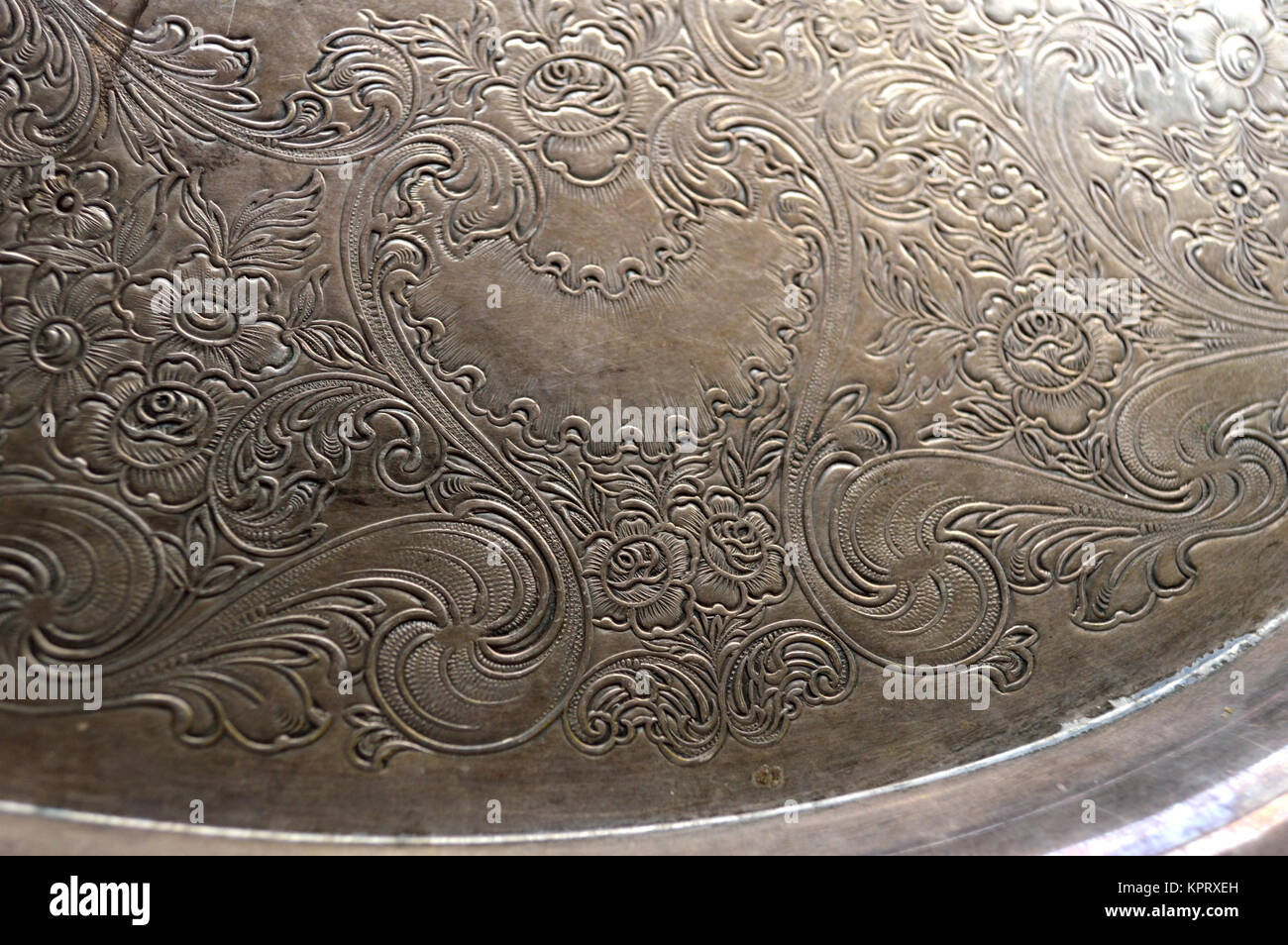Tarnished silver scrollwork background Stock Photo - Alamy
