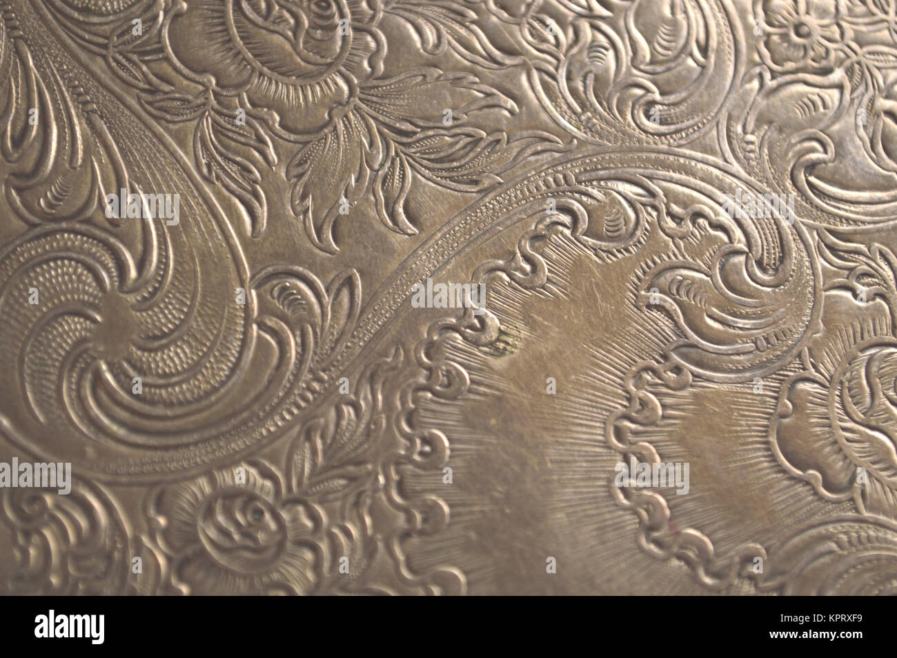 Tarnished silver scrollwork background Stock Photo - Alamy