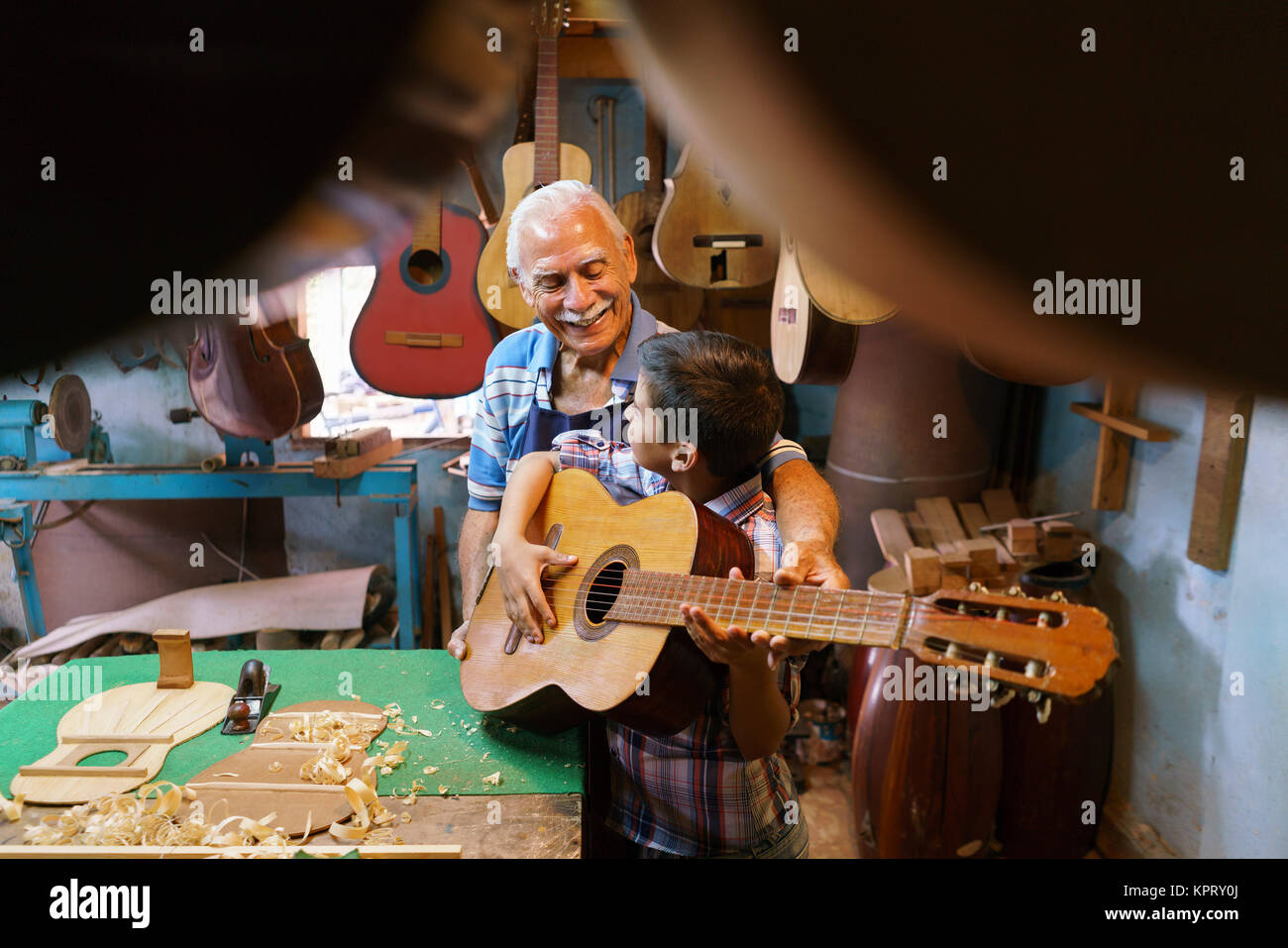 Boy learns guitar hi-res stock photography and images - Alamy