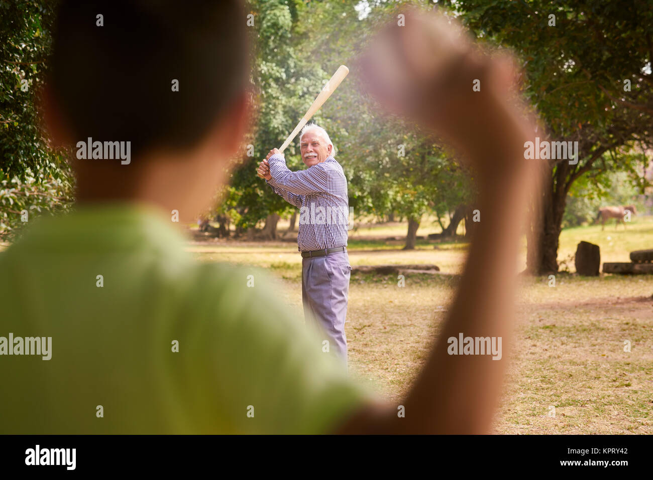 Grandpa and Grandson Boy Playing Baseball In Park Stock Photo - Alamy