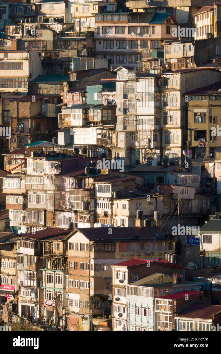 Tiered houses and ramshackle buildings on steep hillside in Shimla ...