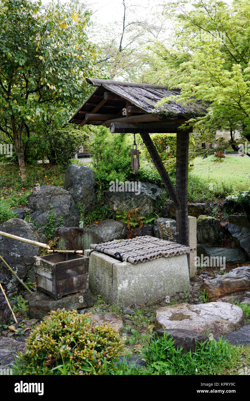 Traditional ancient stone well in japanese garden Stock Photo - Alamy