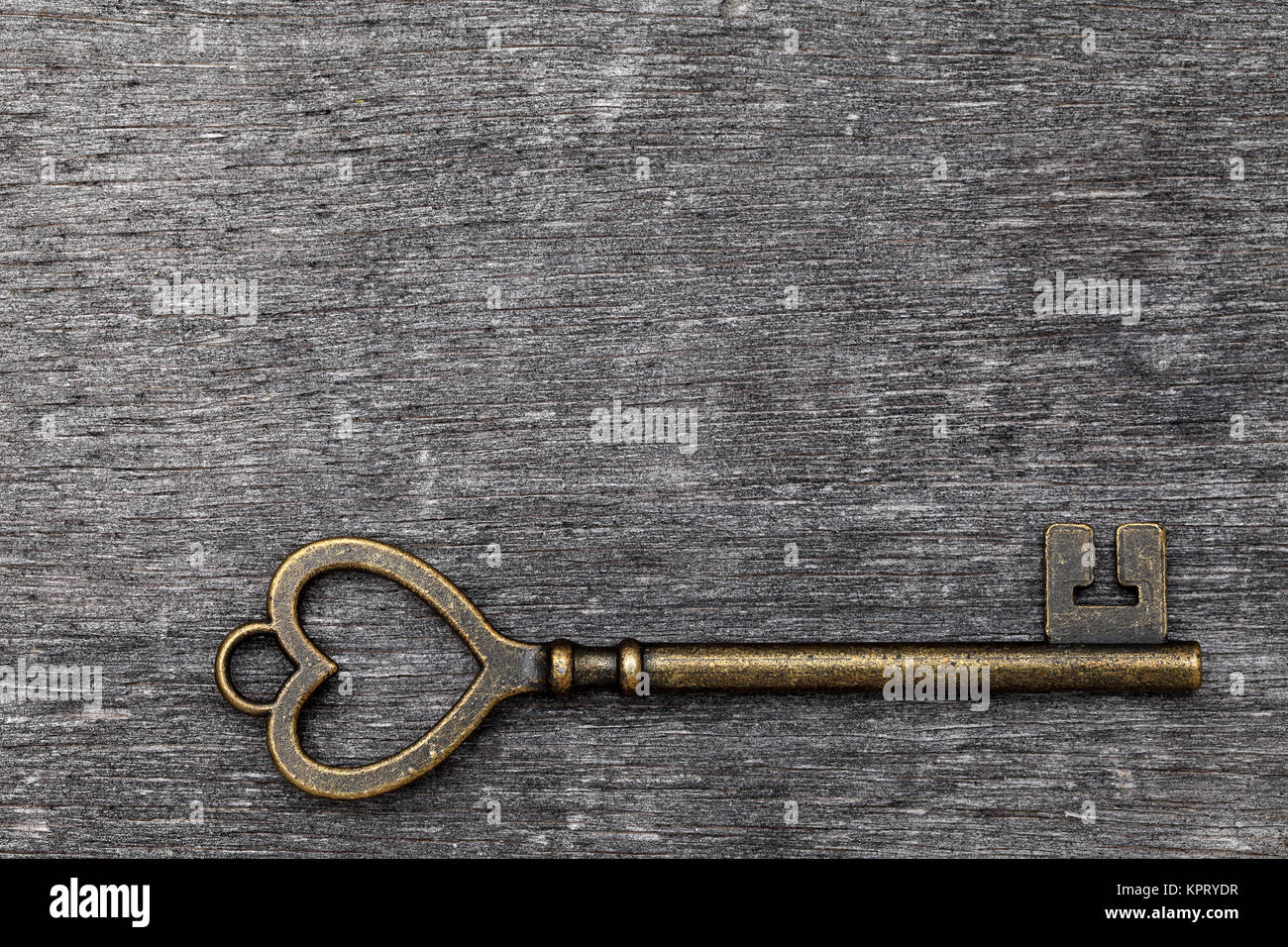 vintage key heart shape on grunge wooden background Stock Photo - Alamy