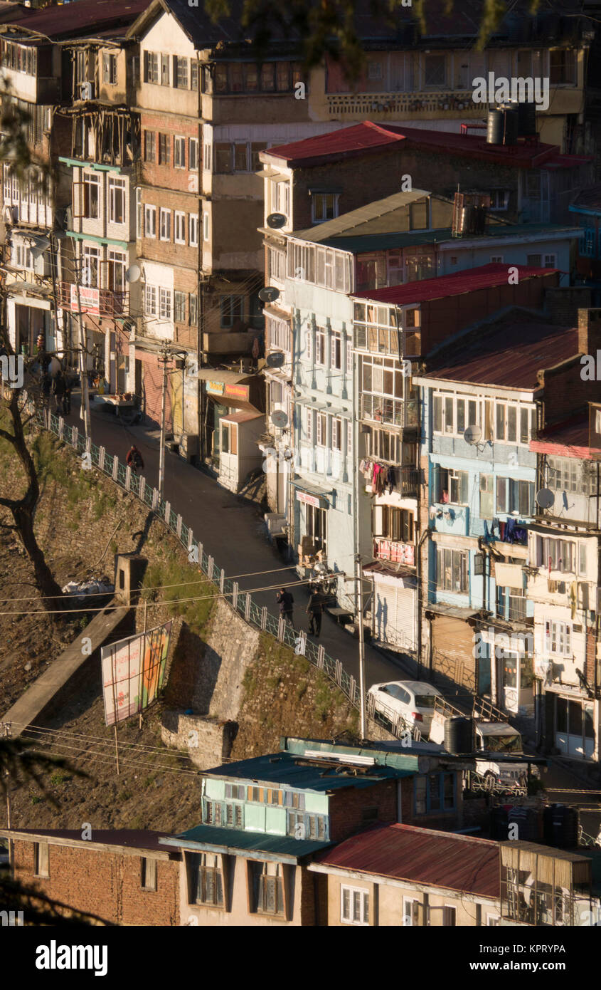 Tiered houses and ramshackle buildings on steep hillside in Shimla ...