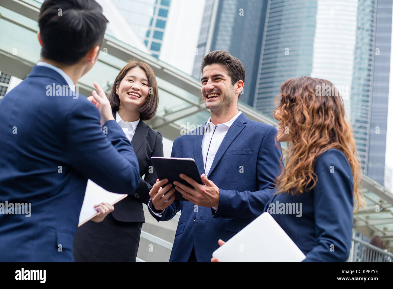 Group of business people talking to each other Stock Photo - Alamy