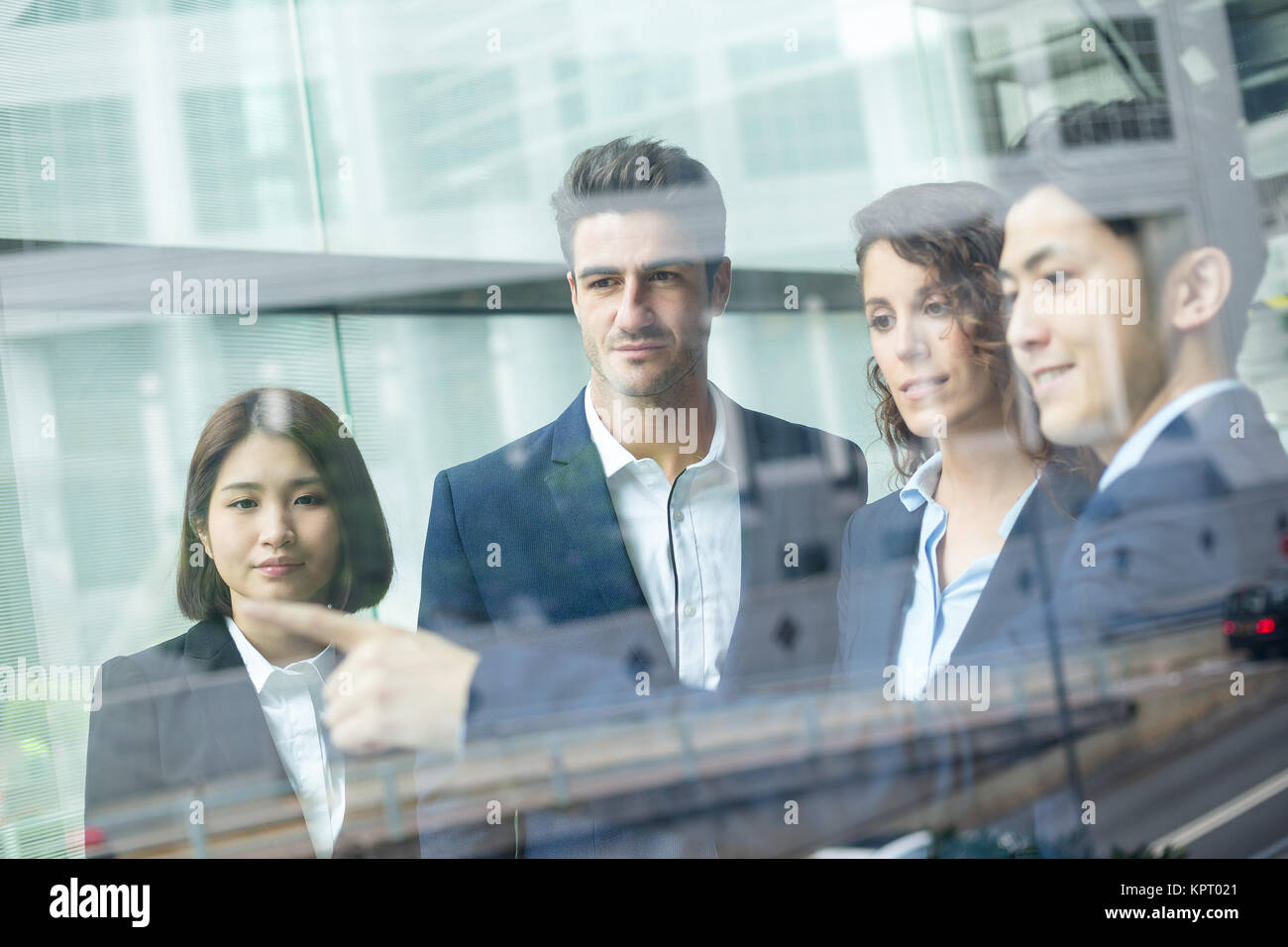 Group of business people discuss something inside office Stock Photo ...