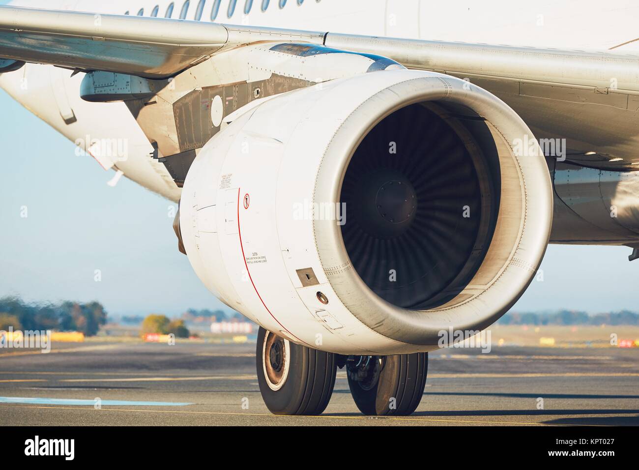 Traffic at the airport. Engine of the airplane on the runway Stock ...