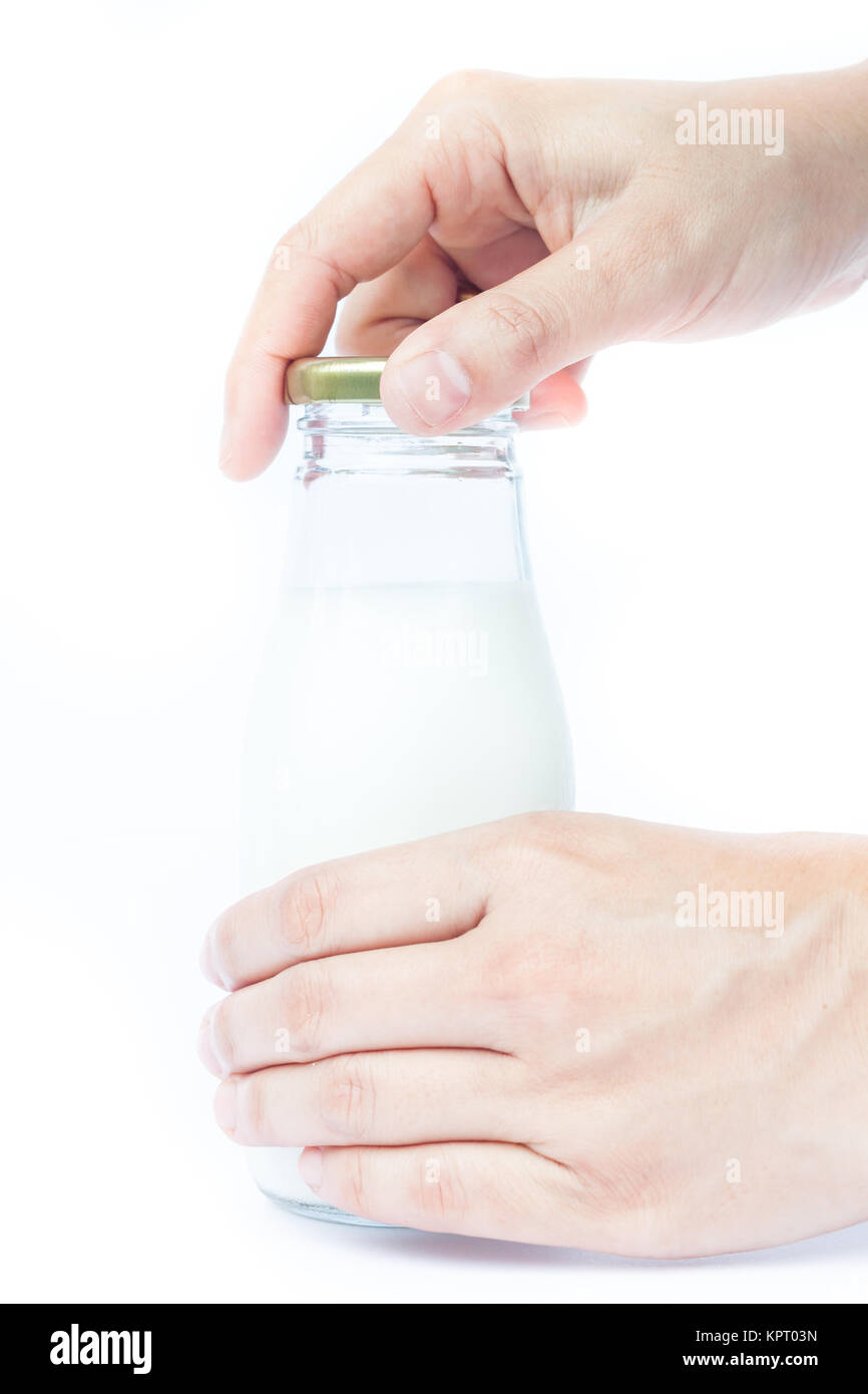 Woman hand open traditional glass milk bottle Stock Photo - Alamy