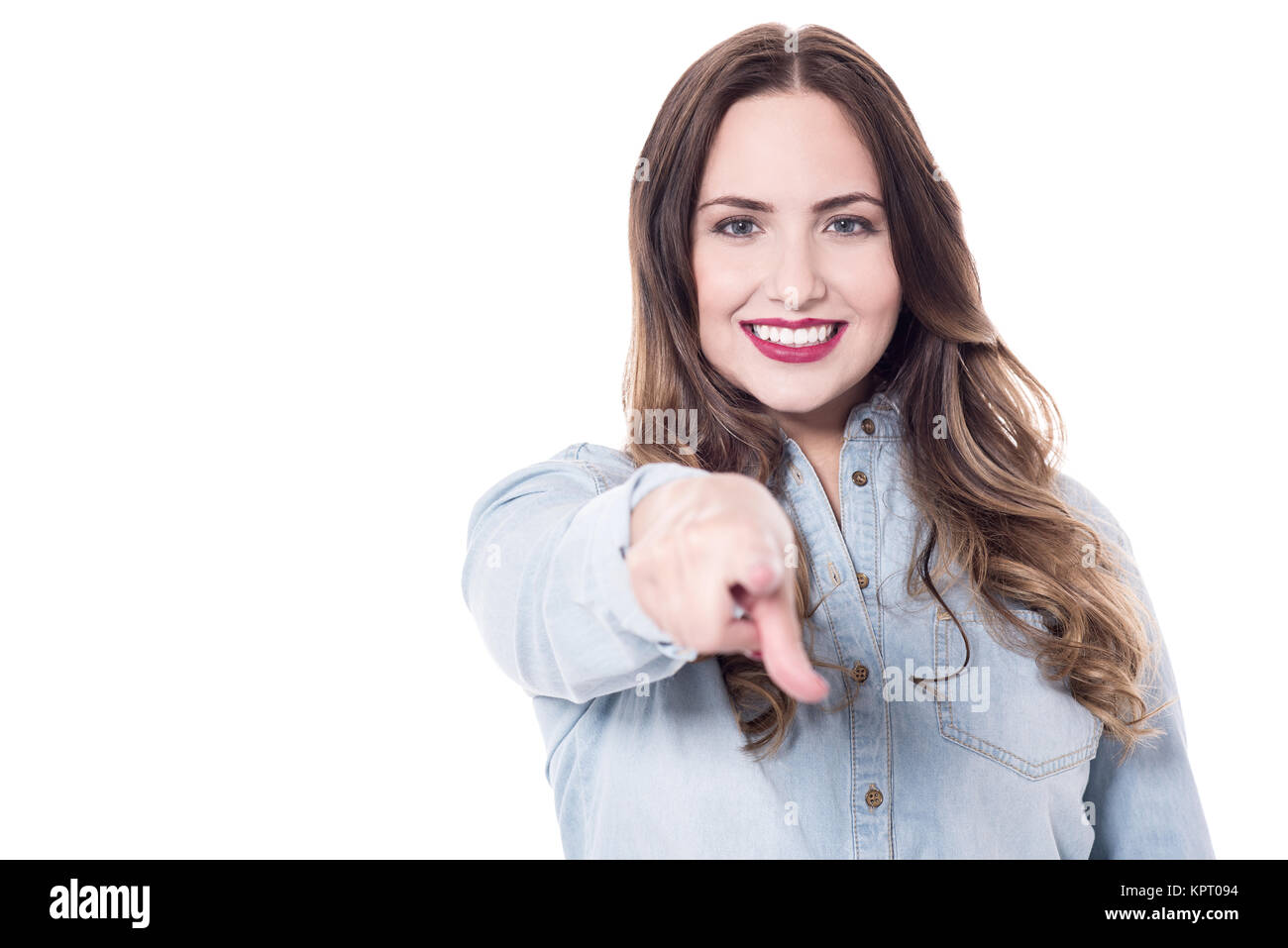Happy young lady pointing at you Stock Photo - Alamy