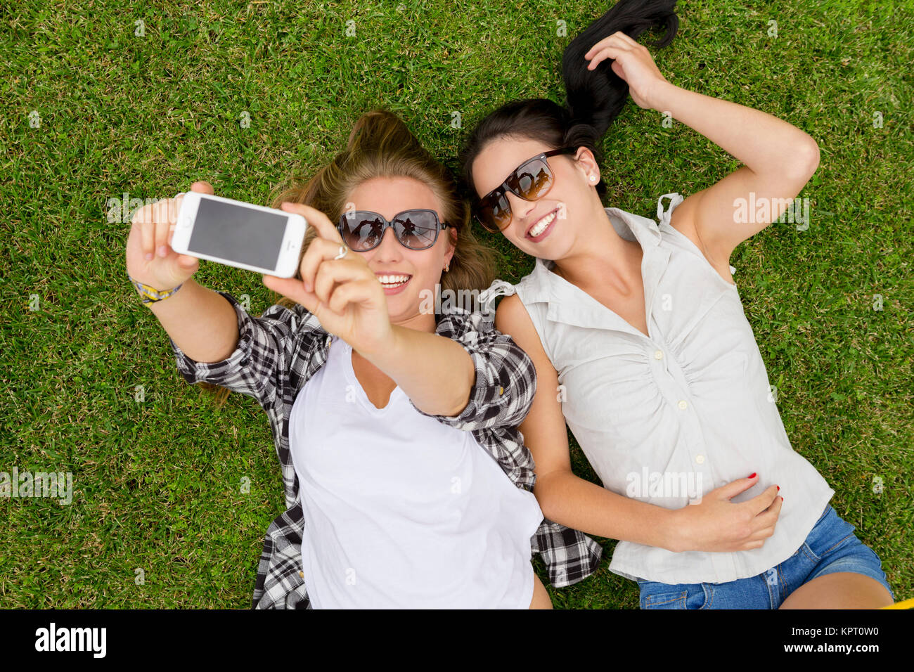 Best friends taking selfies Stock Photo - Alamy