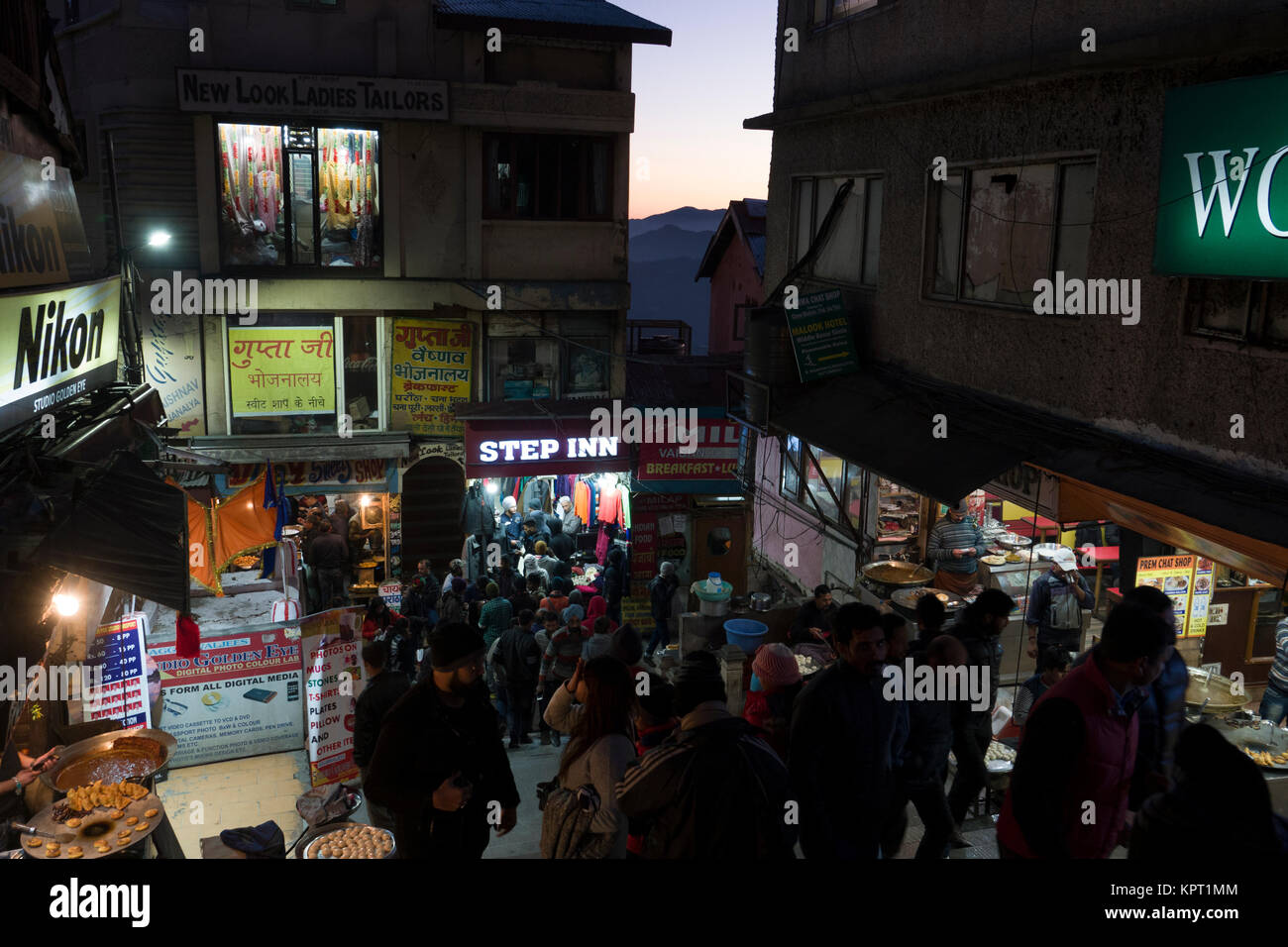 People shopping in lower bazaar market at dusk in Shimla, India Stock ...
