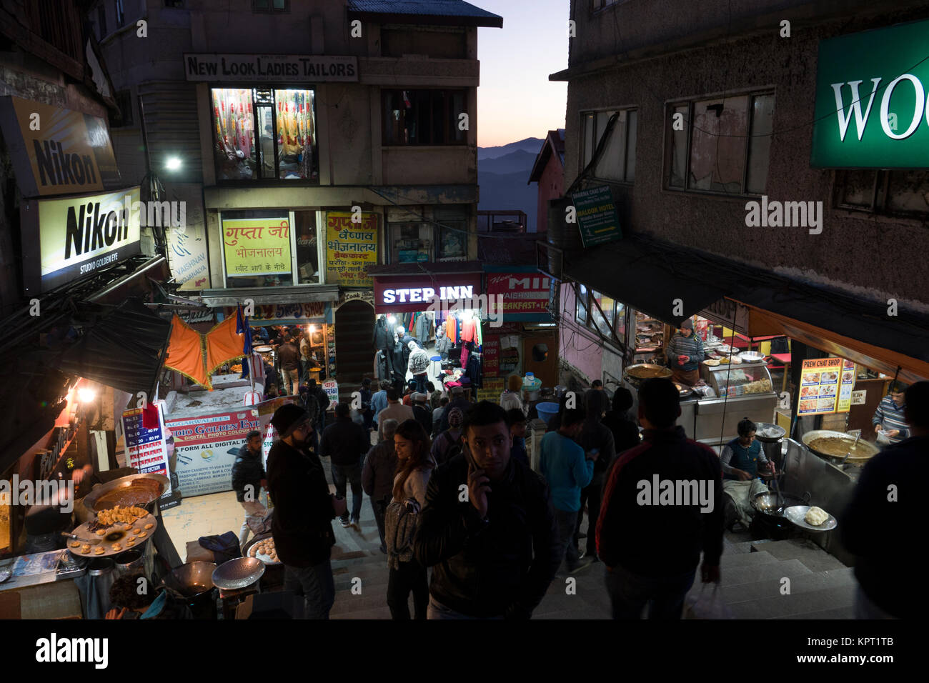 People shopping in lower bazaar market at dusk in Shimla, India Stock ...