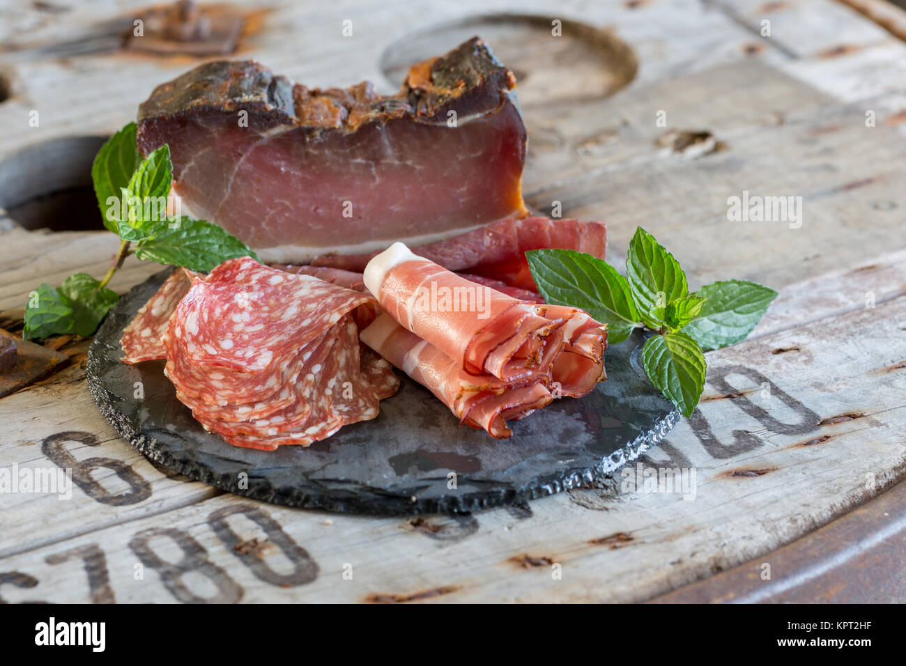 a selection of fine ham on a wooden ground Stock Photo - Alamy