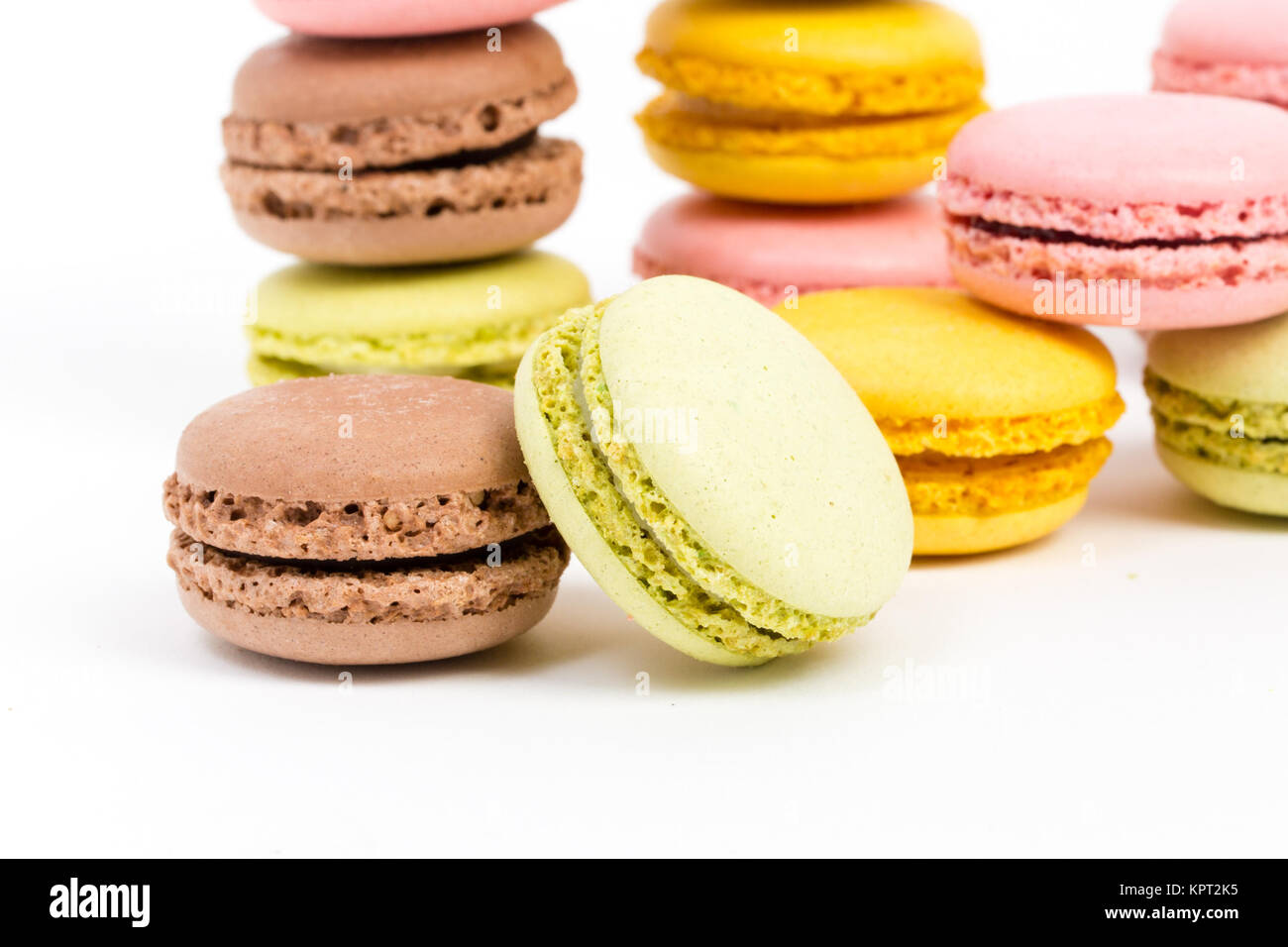 some sweet colorful biscuits against white background Stock Photo - Alamy