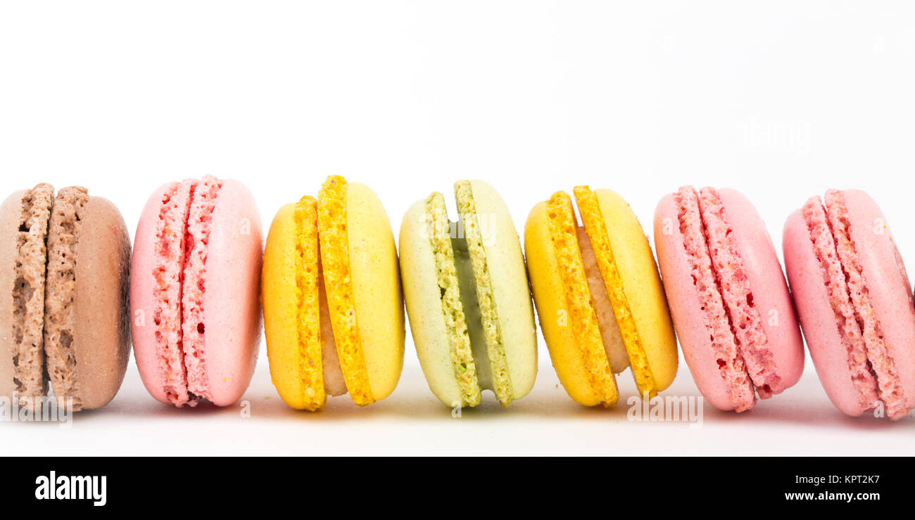 some sweet colorful biscuits against white background Stock Photo - Alamy