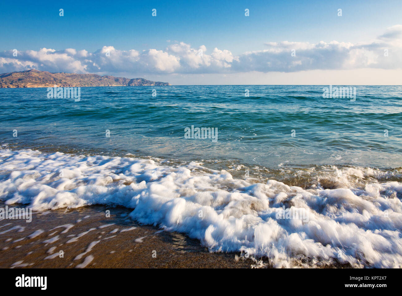 Summer beach in Greece. Sea, beach and beautiful clouds Stock Photo - Alamy