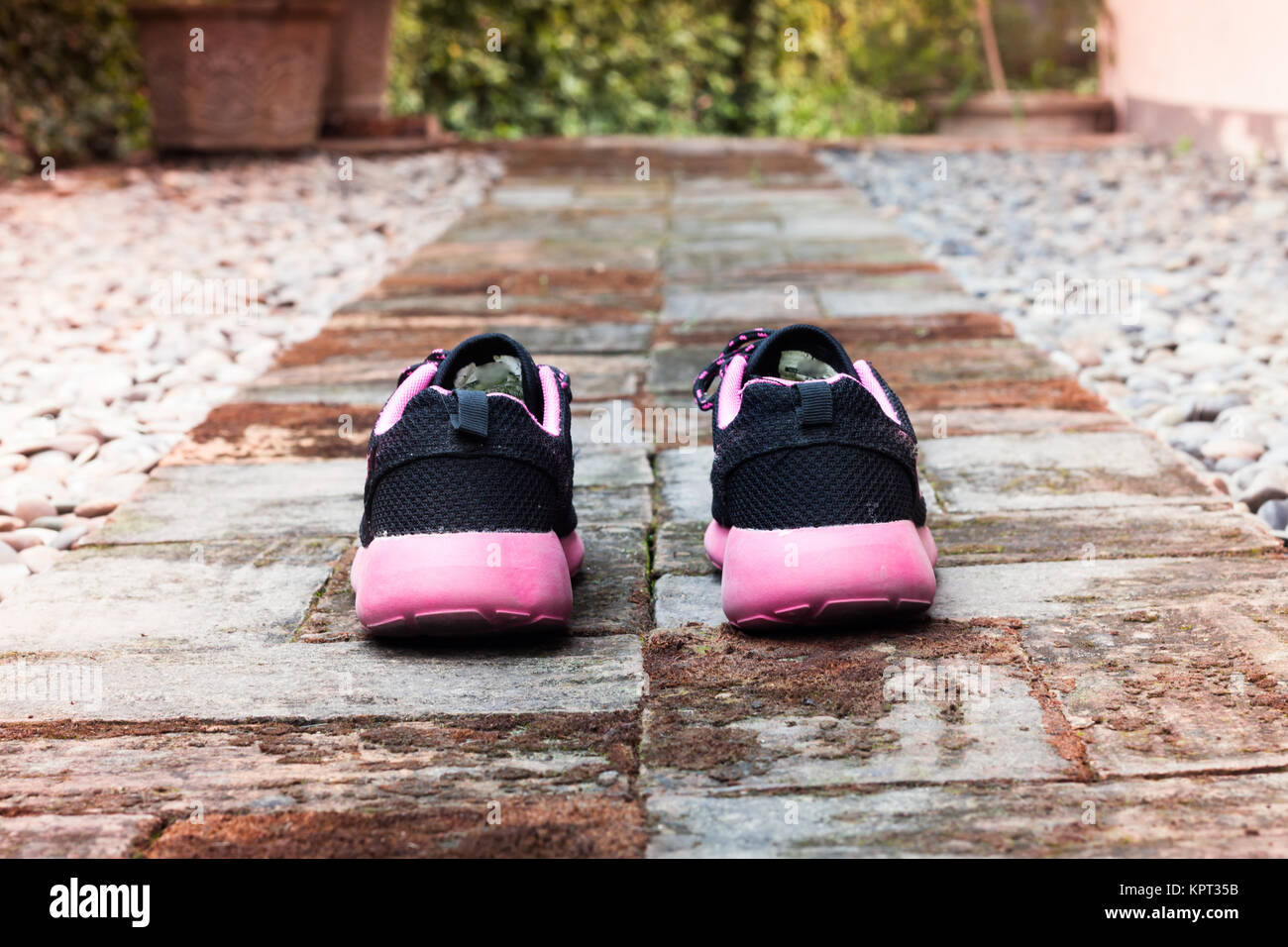 Running shoes in home garden foot path, stock photo Stock Photo - Alamy