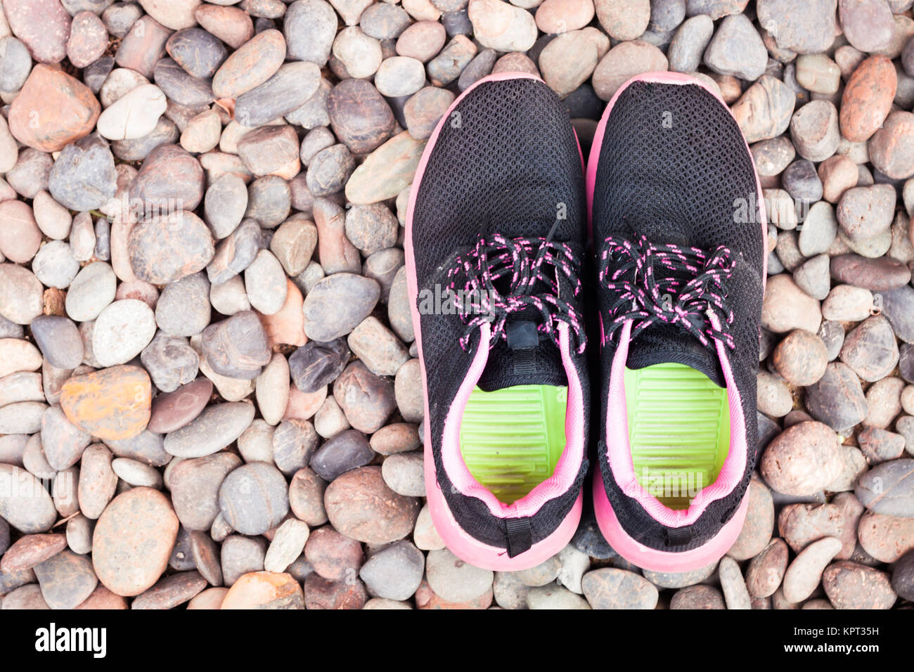 Running shoes in home garden on pebbles, stock photo Stock Photo - Alamy