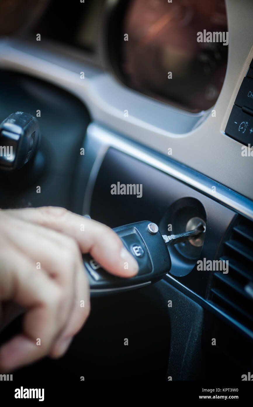 Color image of a hand inserting the ignition key of a car Stock Photo ...