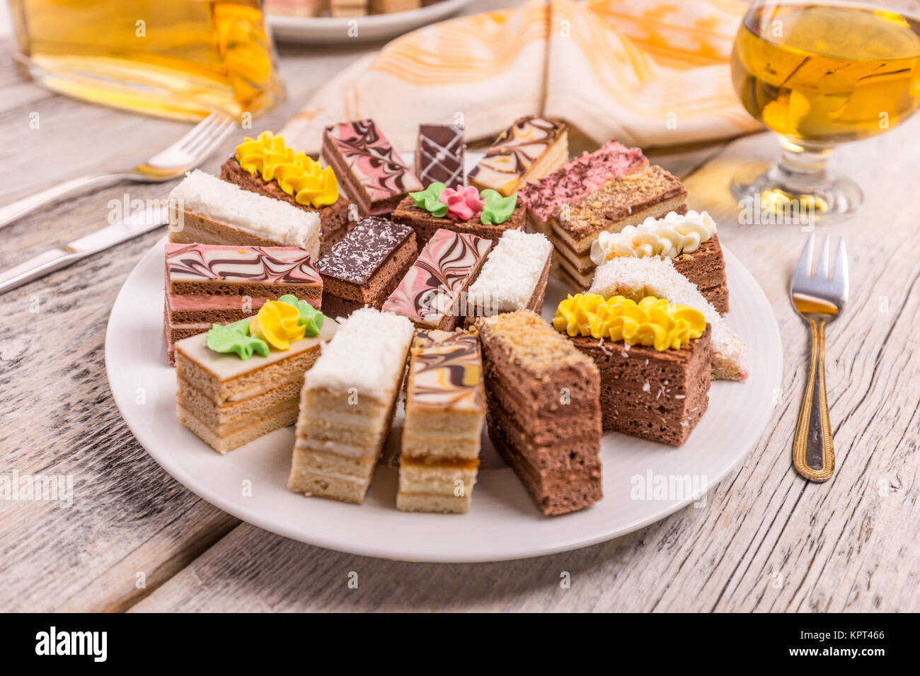 Assorted different mini cakes with cream Stock Photo - Alamy