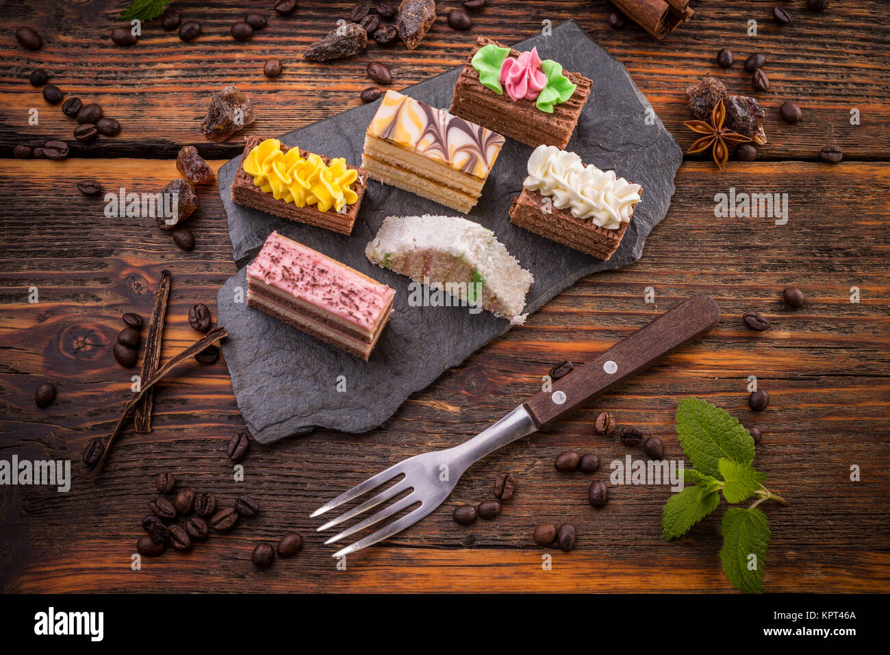 Assorted different mini cakes with cream Stock Photo - Alamy