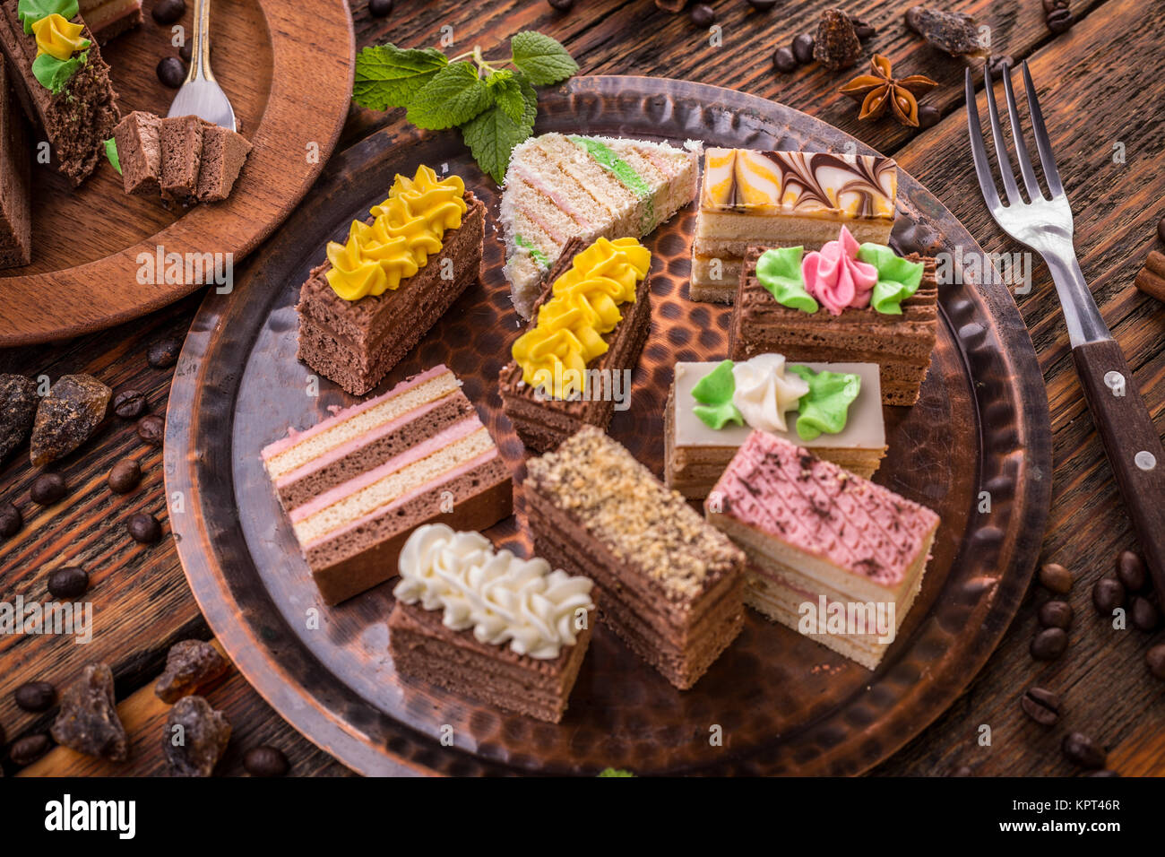 Assorted different mini cakes with cream Stock Photo - Alamy