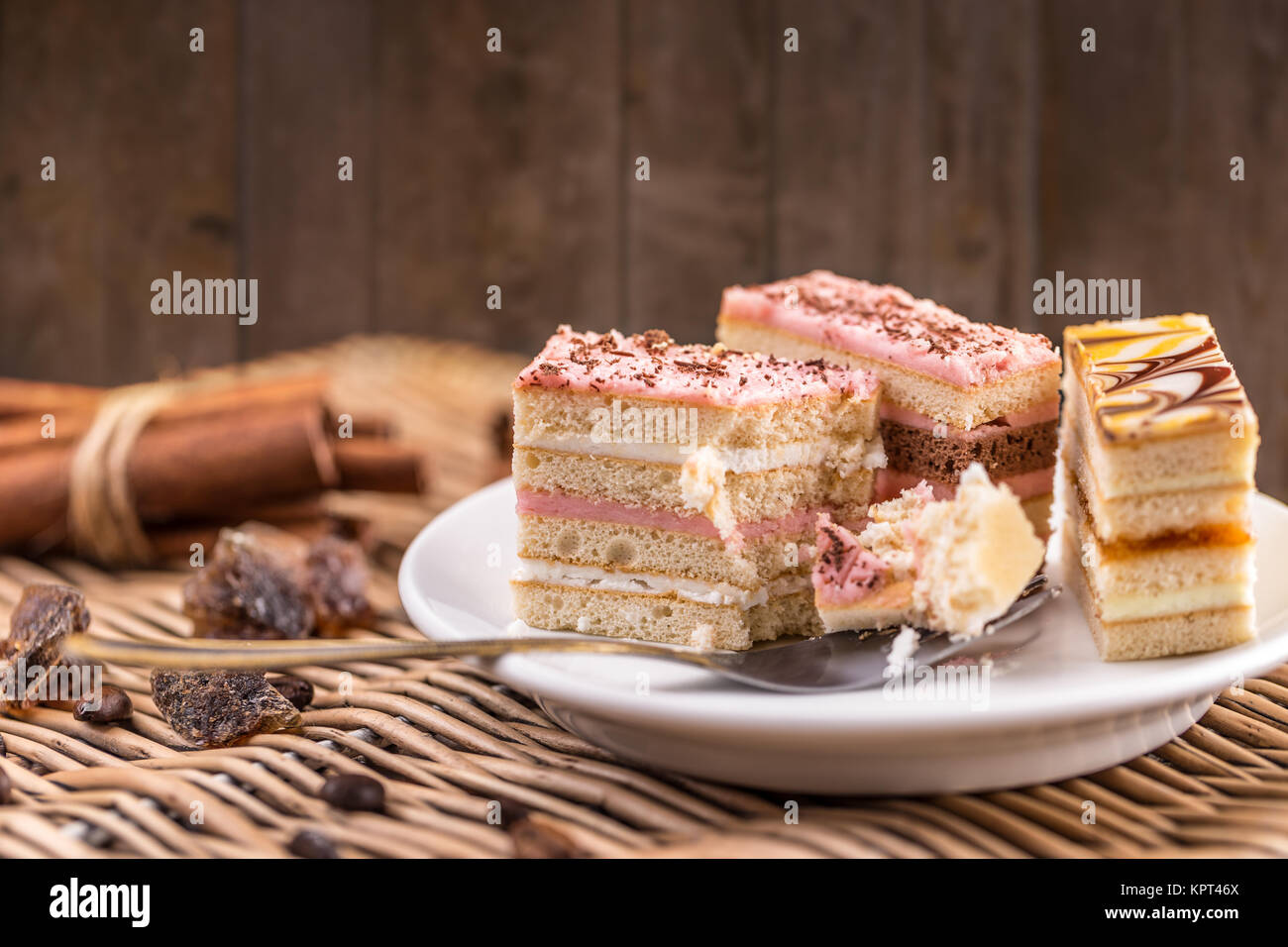 Three different pastries on white plate Stock Photo - Alamy